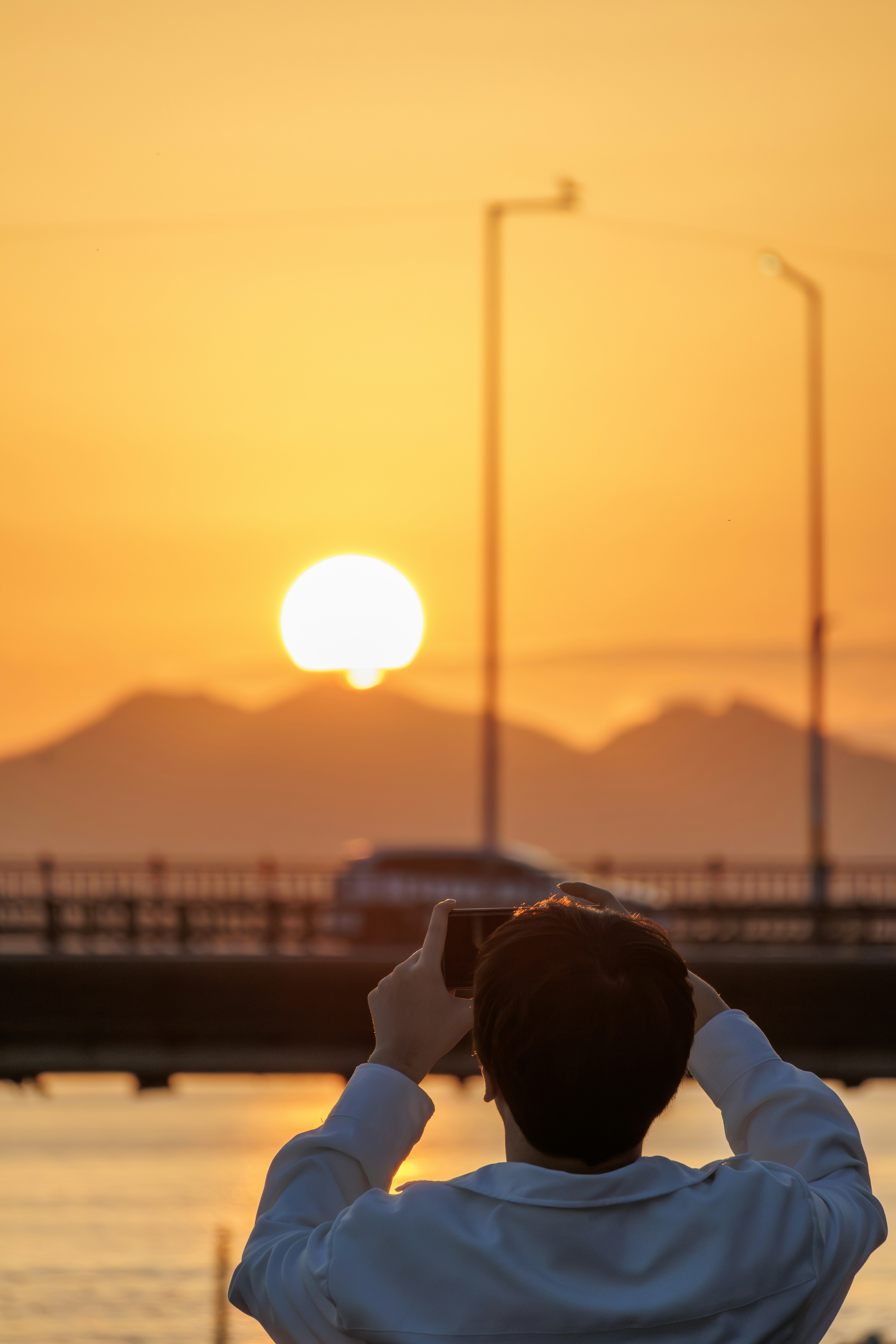 Golden Hour on the Pier: A Silhouette Framing the Sunset