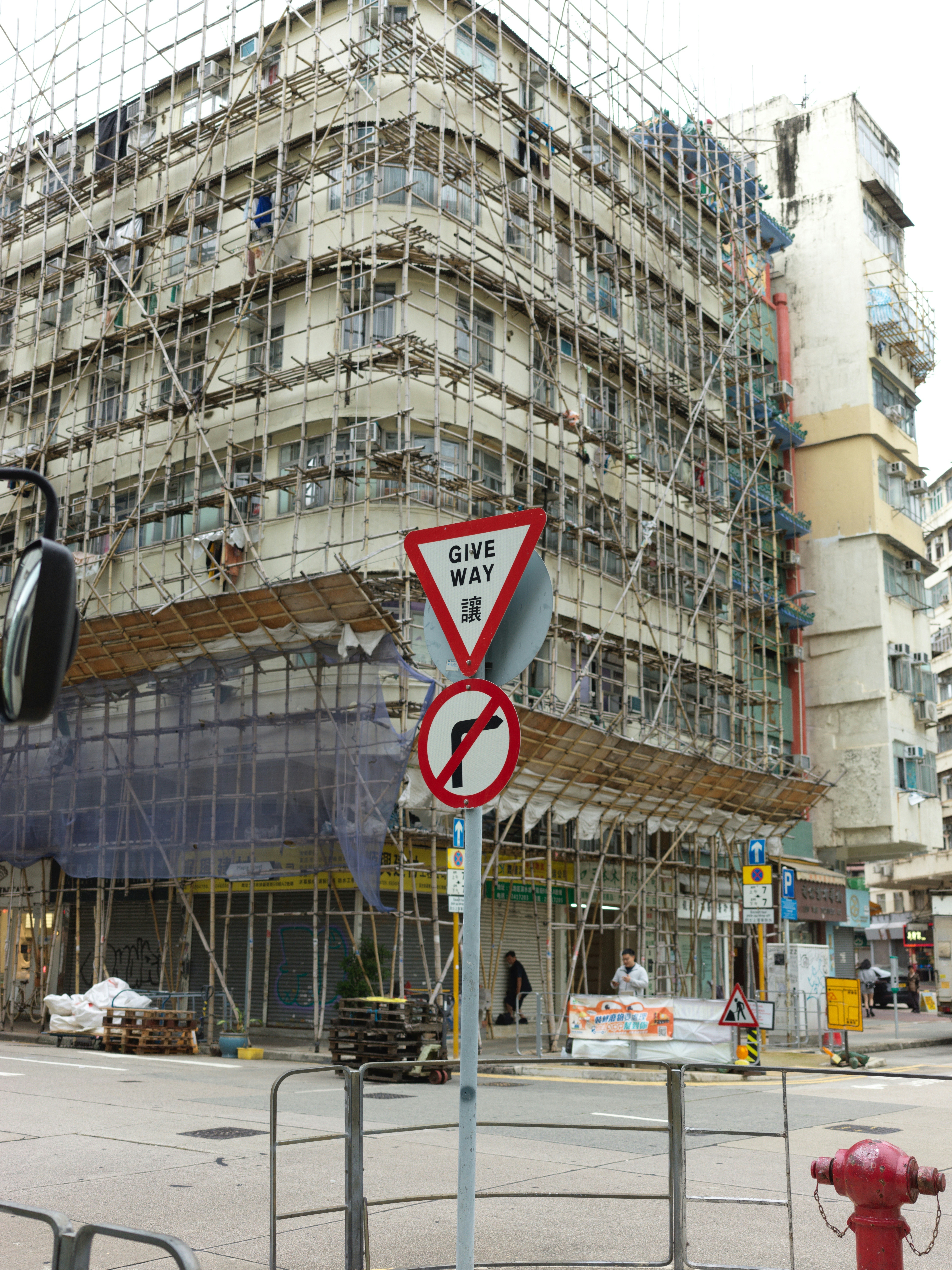 A large building under construction with scaffolding around it photo ...
