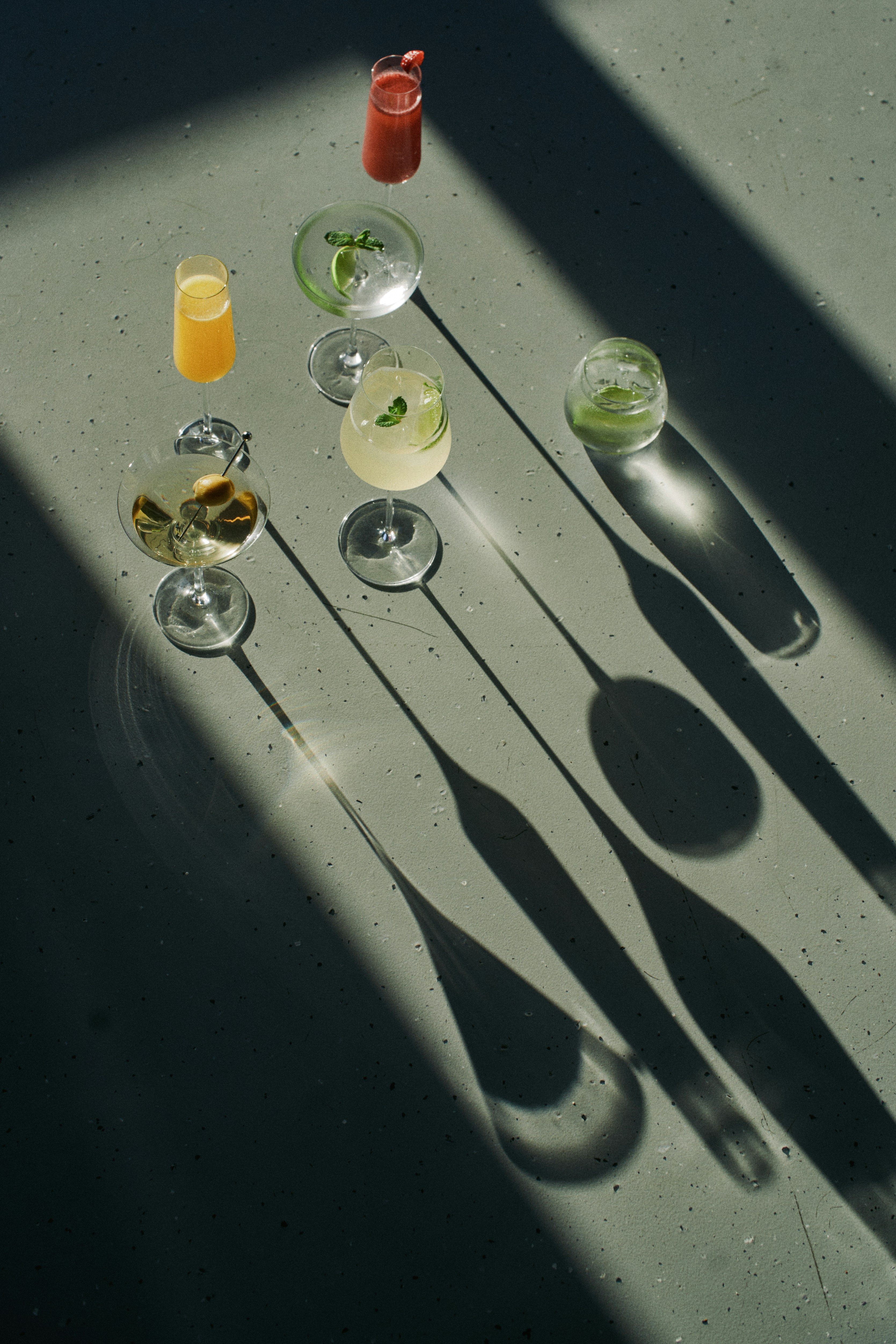 Shadows and Sips: A Sunlit Parade of Glassware