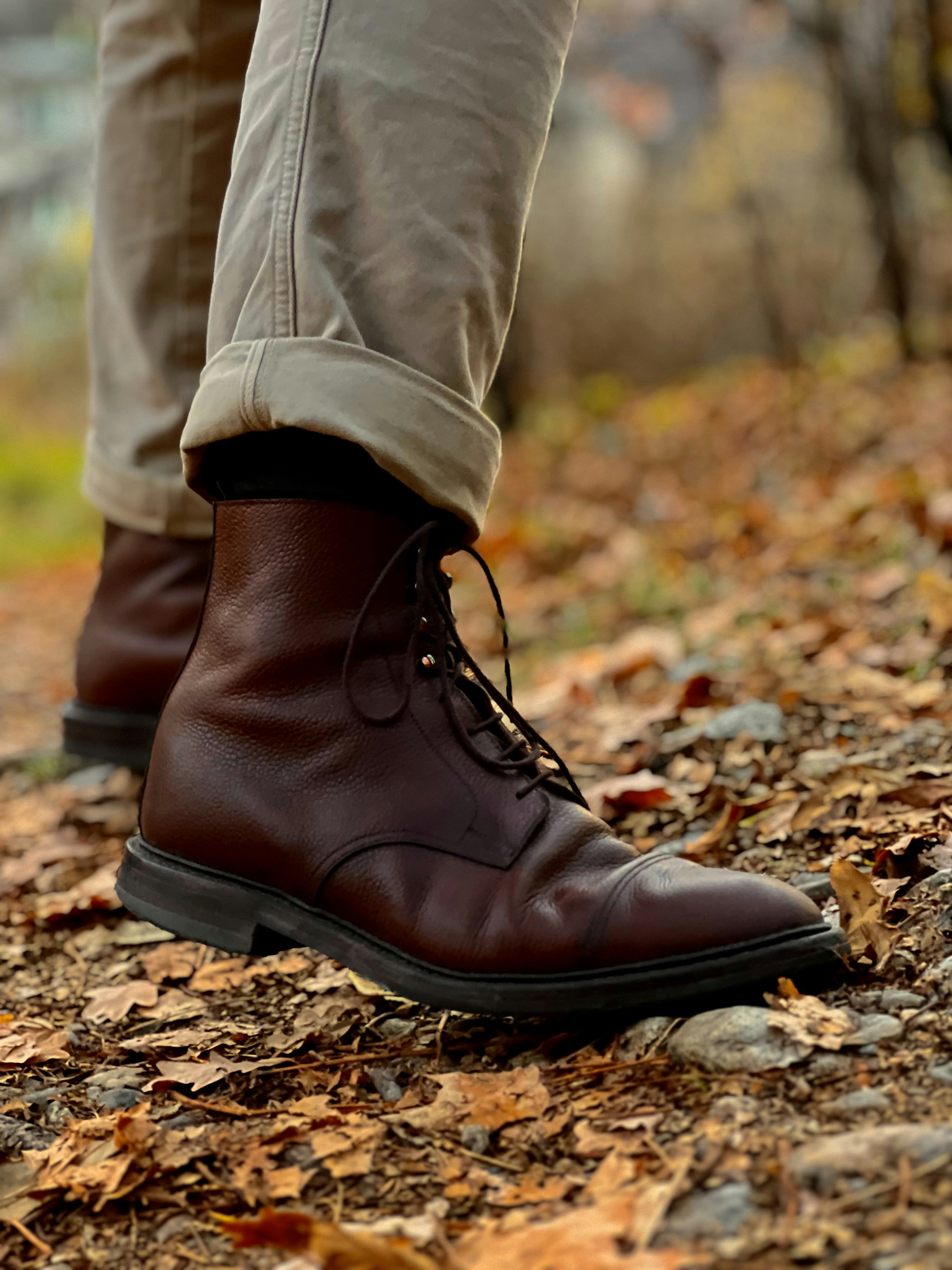Autumn Bootprint: A Close-Up on a Leaf-Littered Path