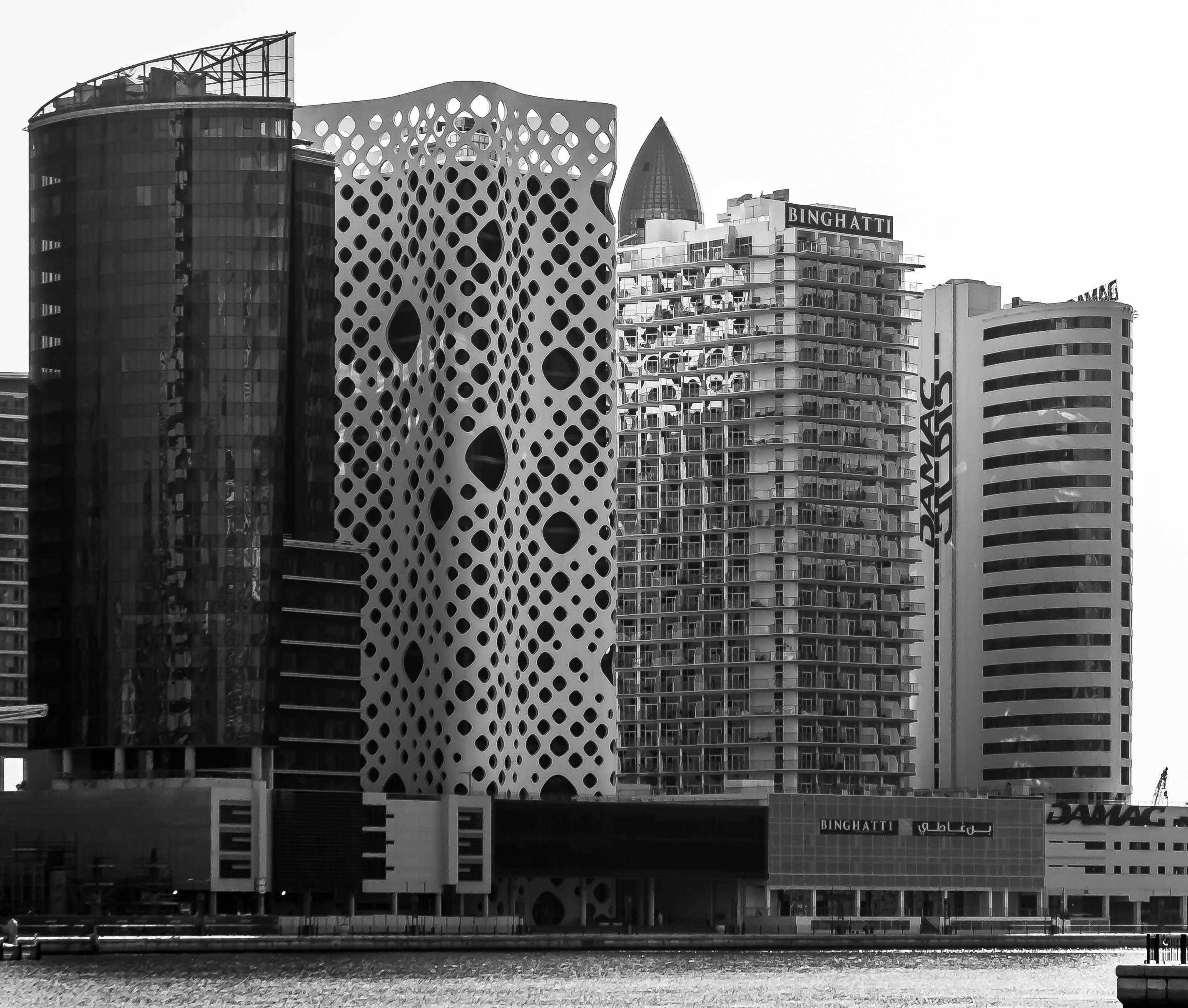 A black and white photo of a city with tall buildings