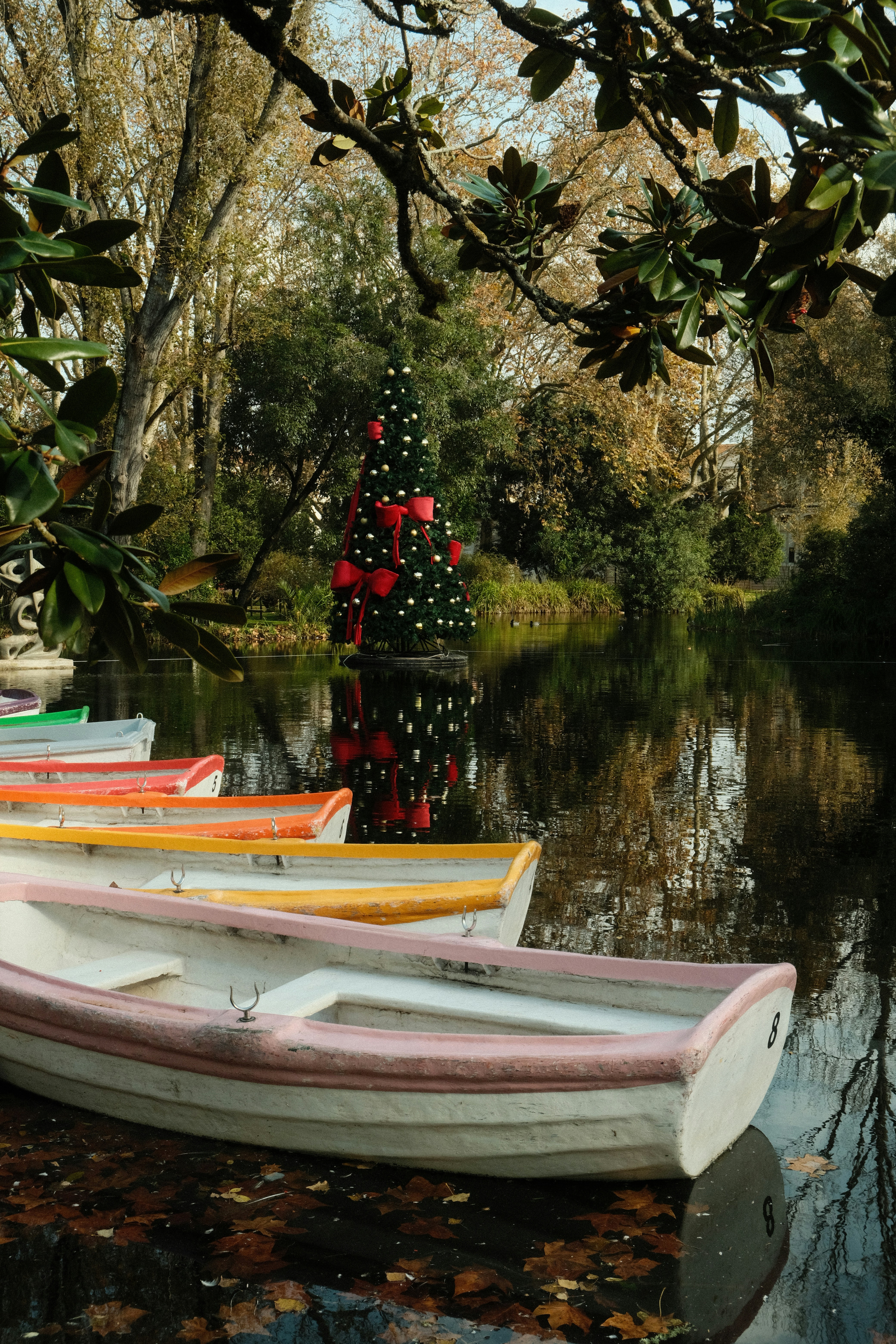 Rowboats Framing a Festive Island on a Quiet Lake