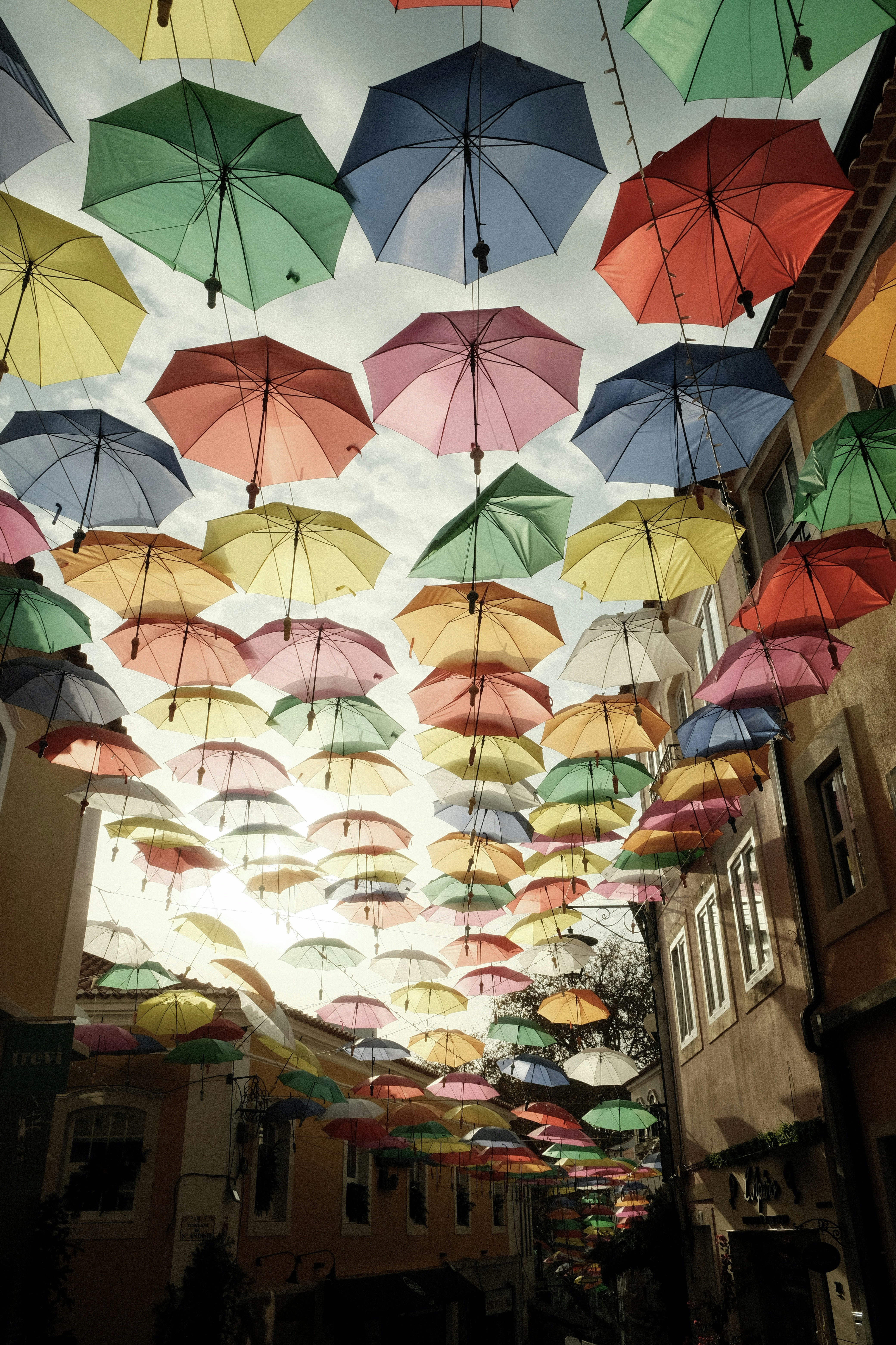 A bunch of umbrellas that are hanging in the air photo – Free Caldas da ...