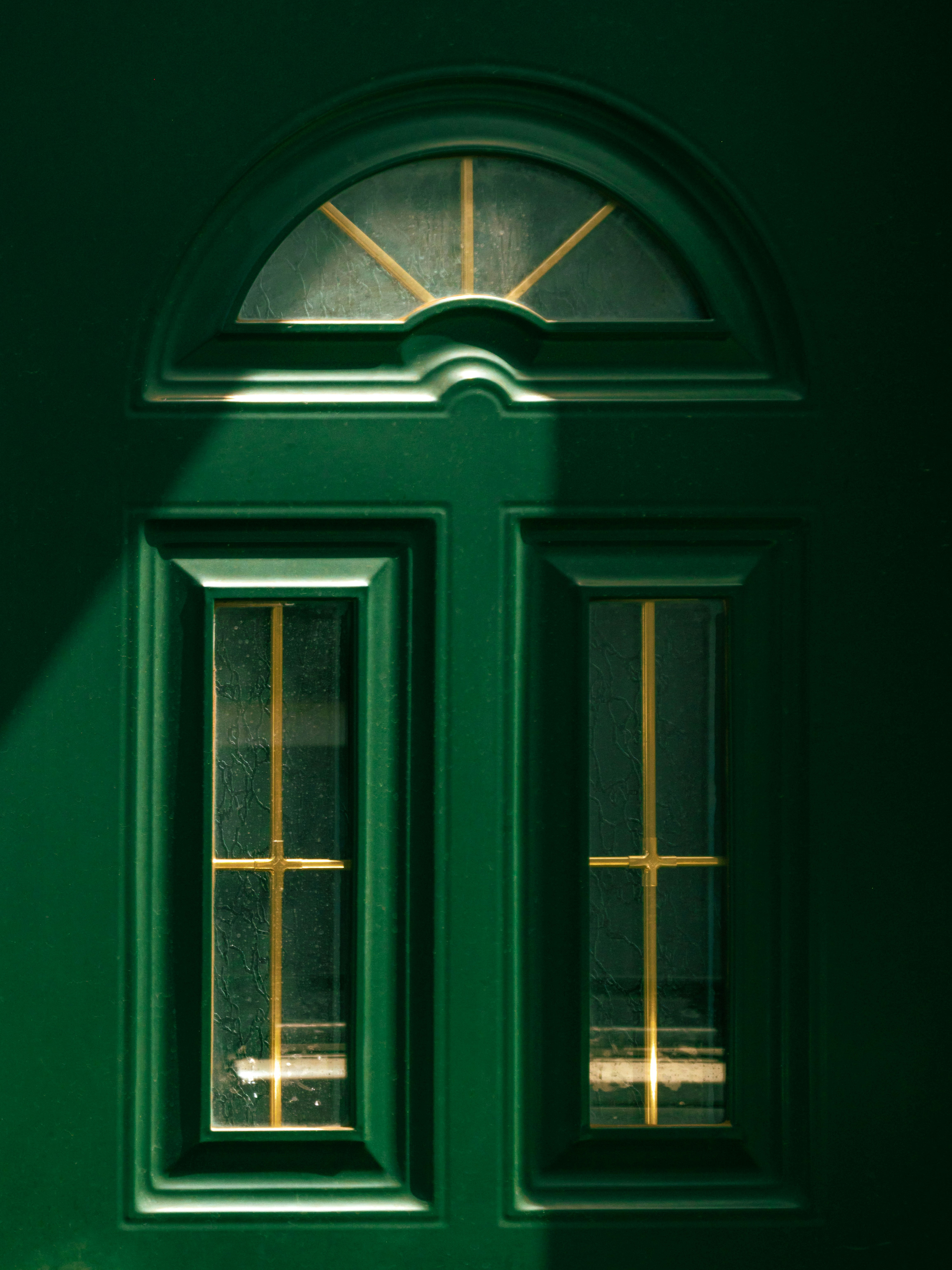 Verdant Doorway: Arch Light Framing a Golden Grid