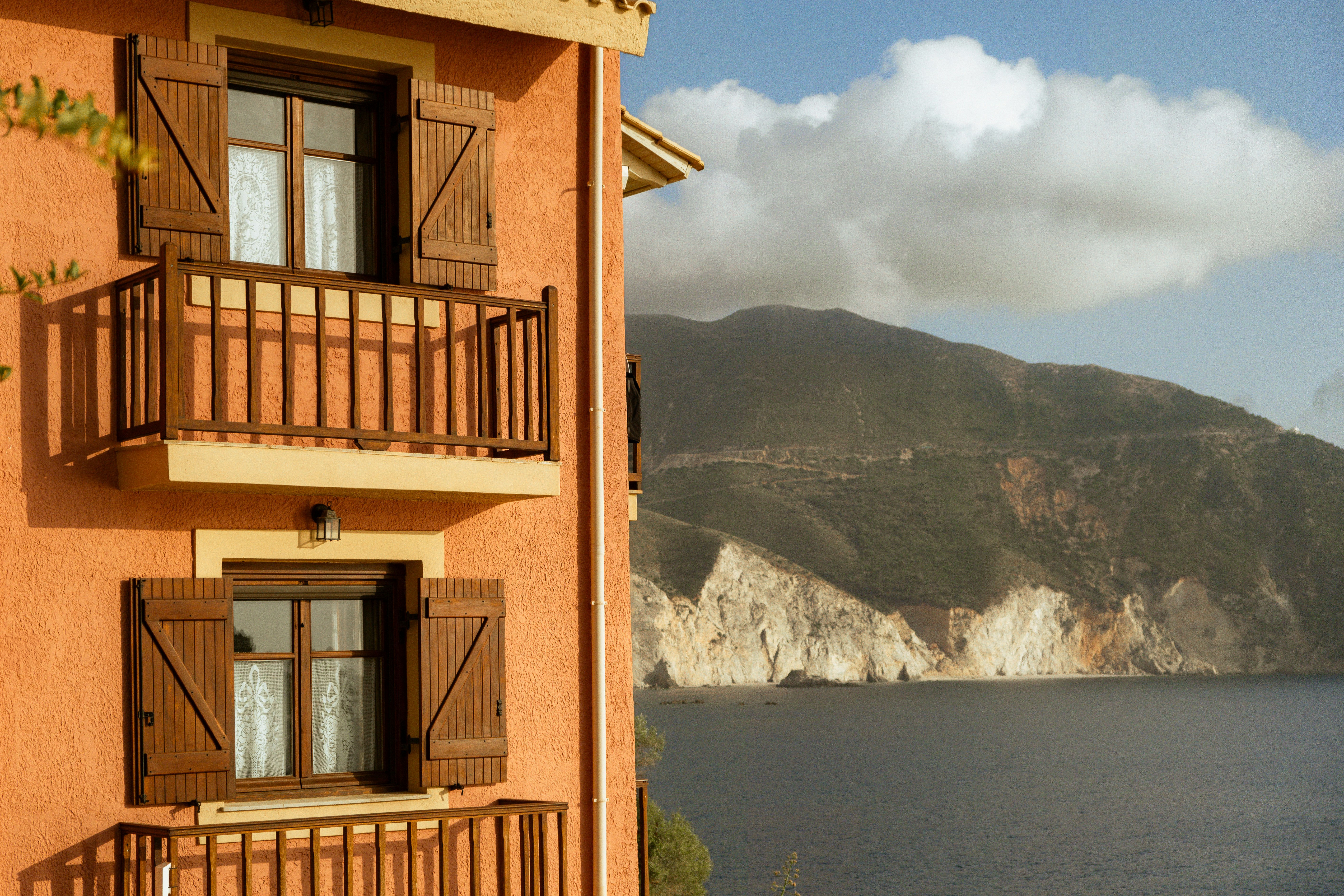 Terracotta Balconies Framing a Coastal Cliff