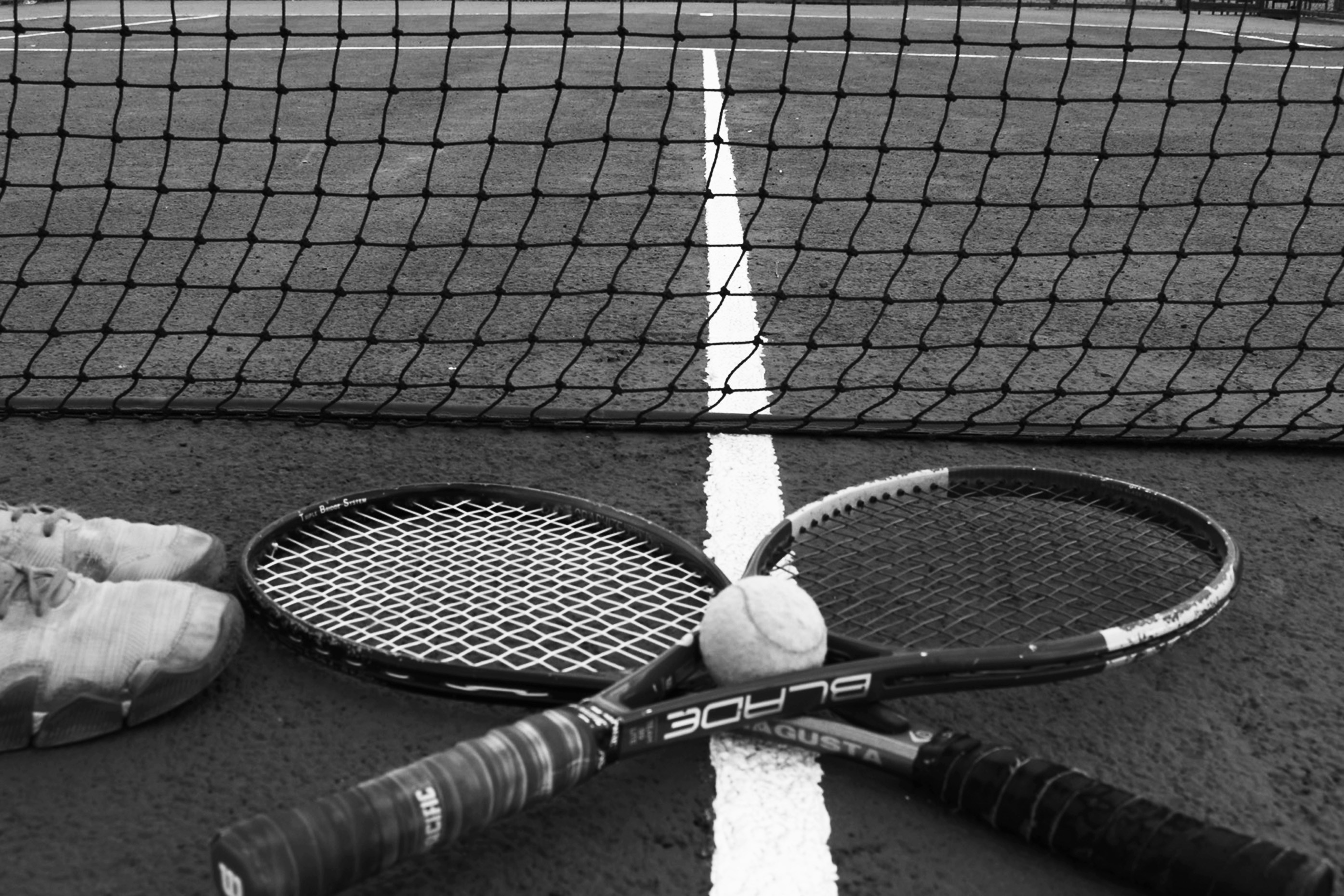 A black and white photo of a tennis racket and ball photo – Free ...