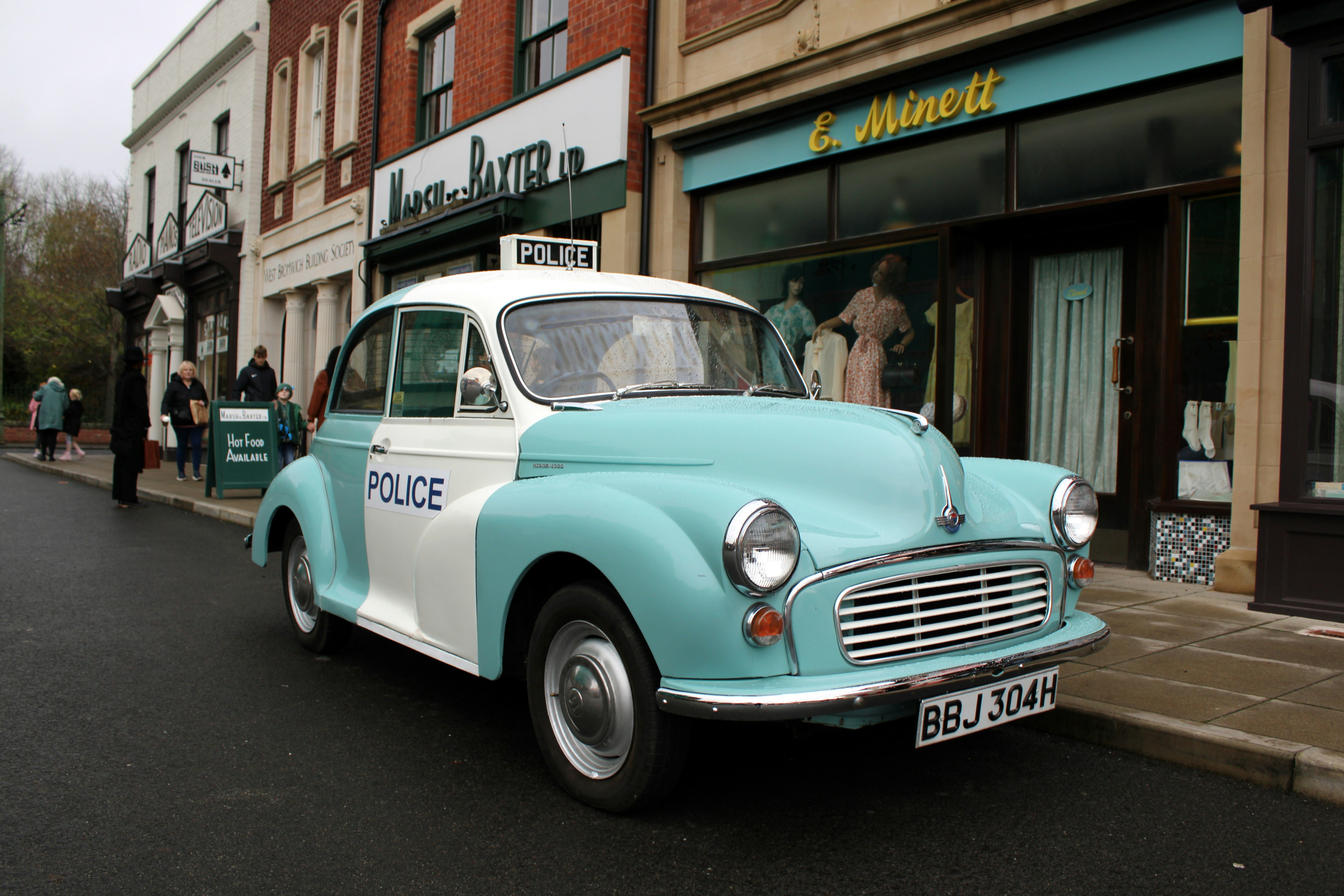 A police car is parked on the side of the road