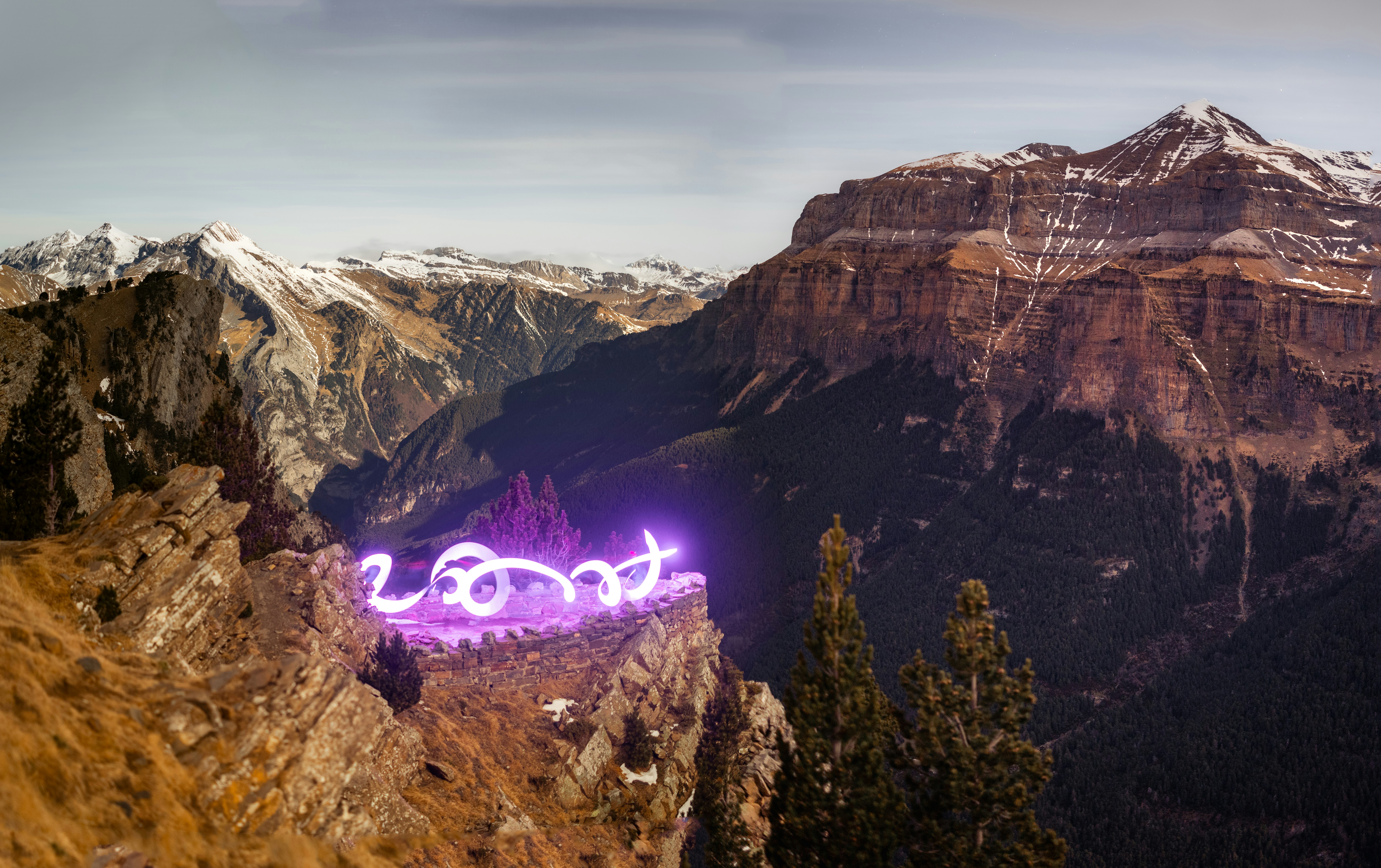 A purple light that is on top of a mountain photo – Free Spain Image on ...