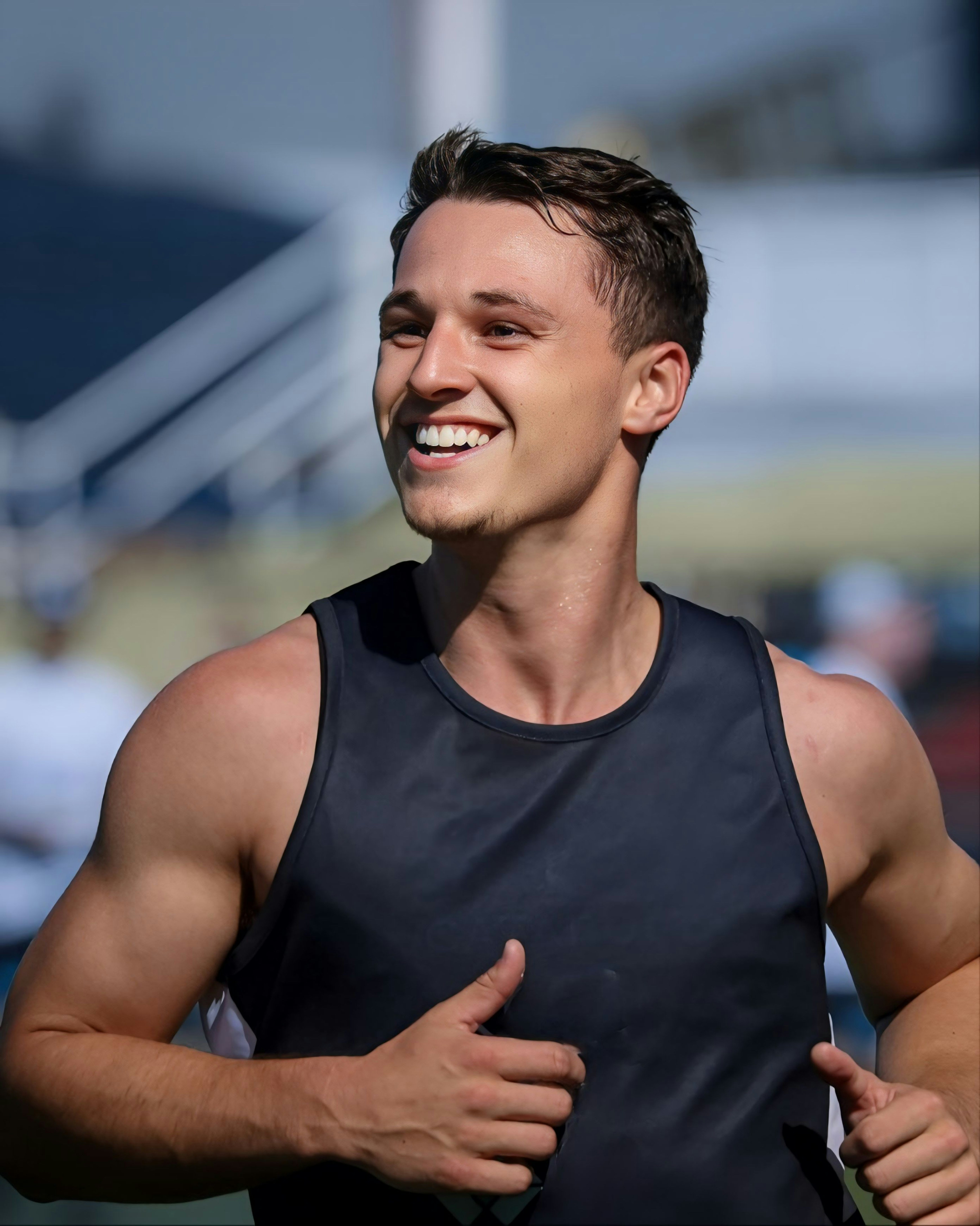 A man running in a race with a smile on his face photo – Free Man Image ...