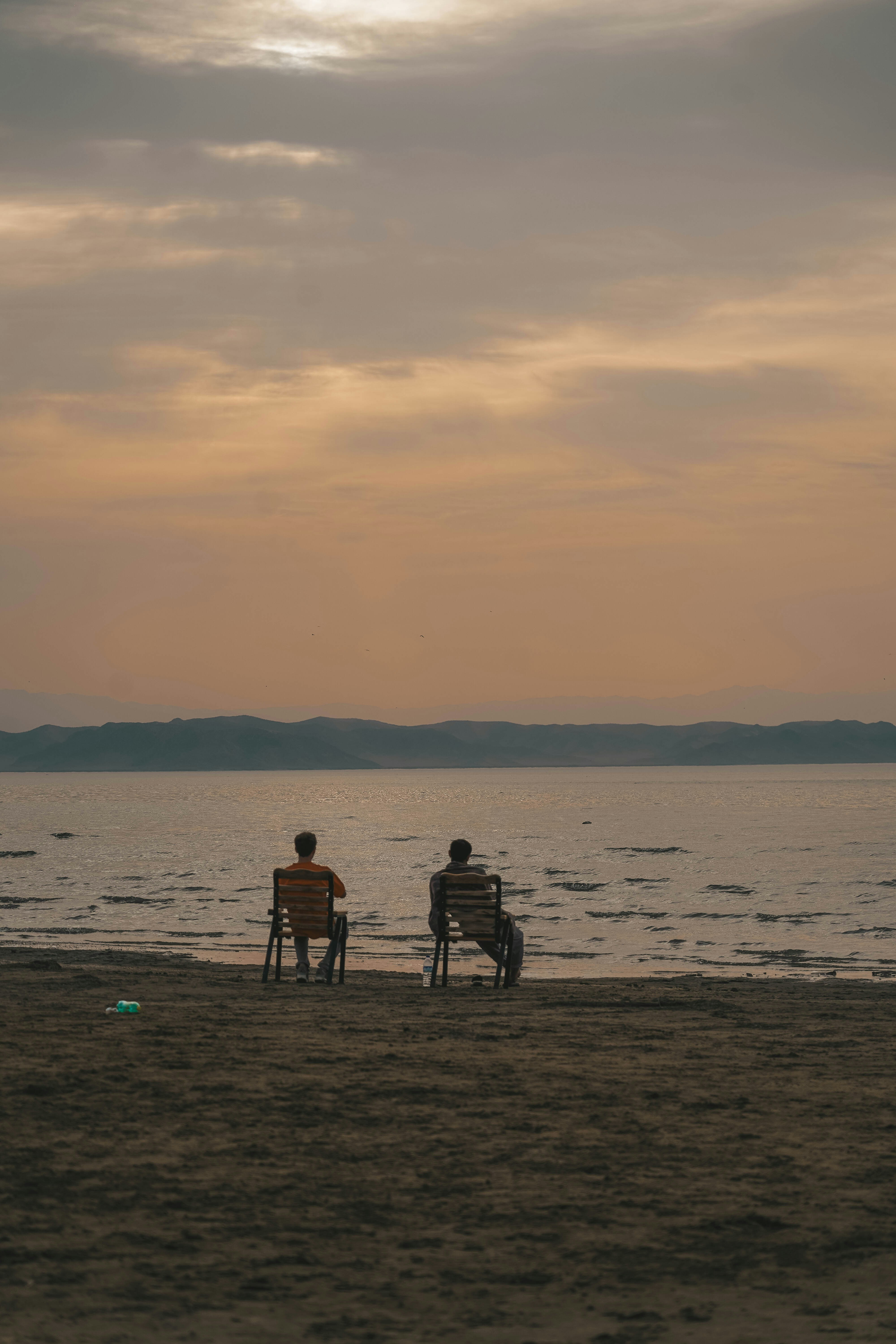 Two Chairs, One Dusk: Contemplation by the Quiet Sea