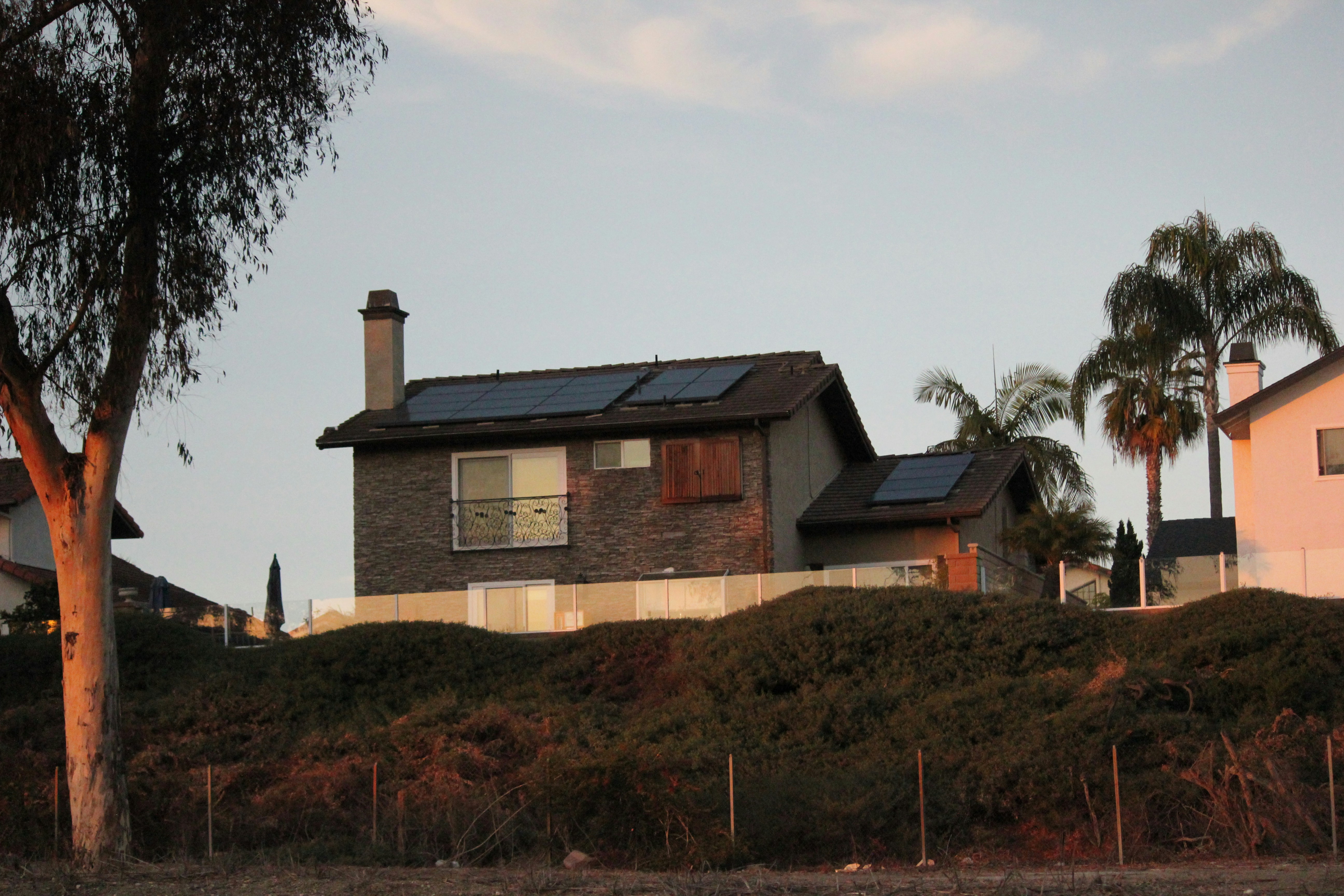 Dusk on the Hill: A Quiet Suburban House with Solar Panels