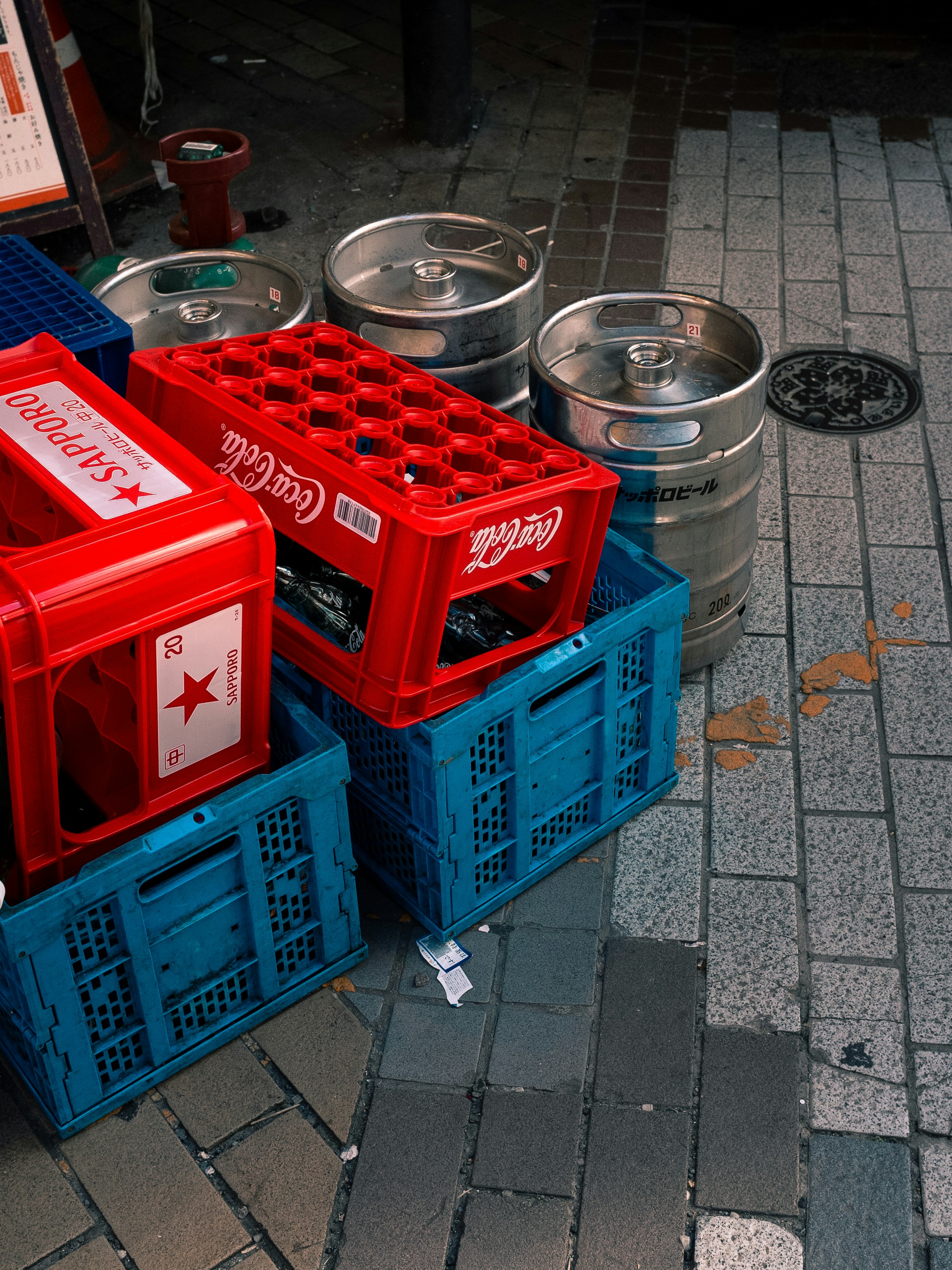 Crimson Crates and Steel Kegs: Street-Level Stack in Color