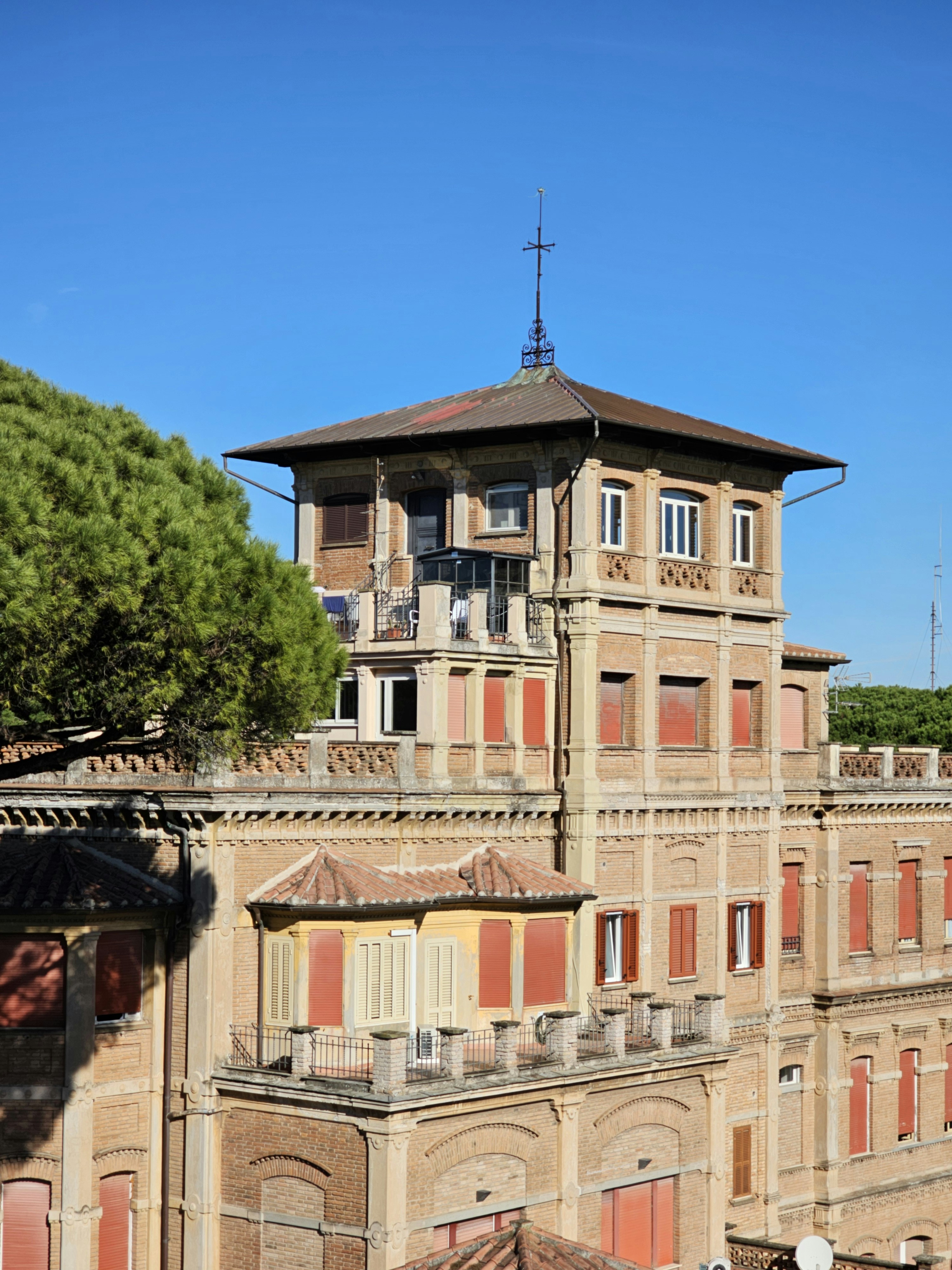 A tall building with a tree in front of it photo – Free Rome Image on ...