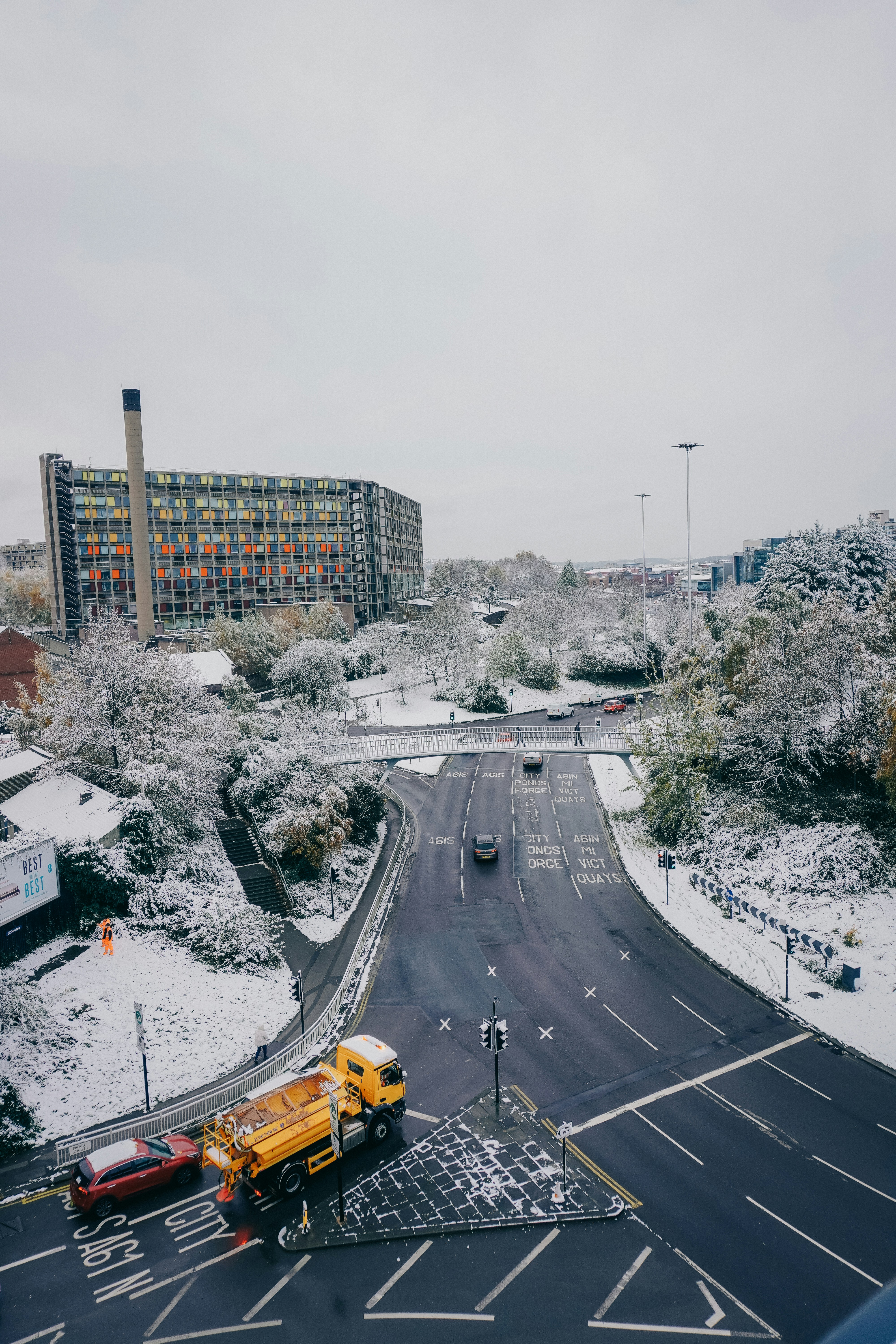 A view of a snowy street from a window photo – Free Road Image on Unsplash