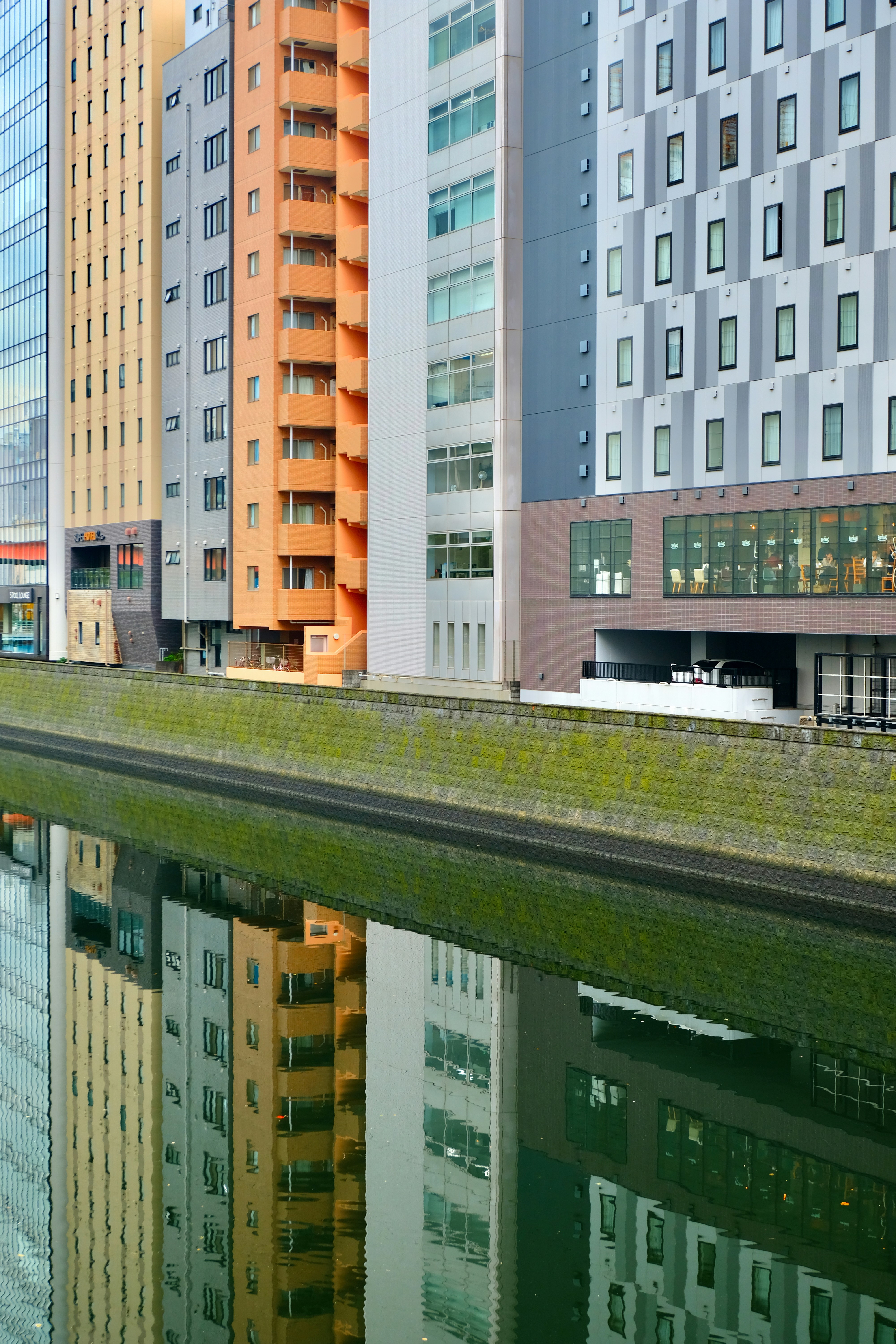 Orange Vertical Arc: Urban Facade Reflections