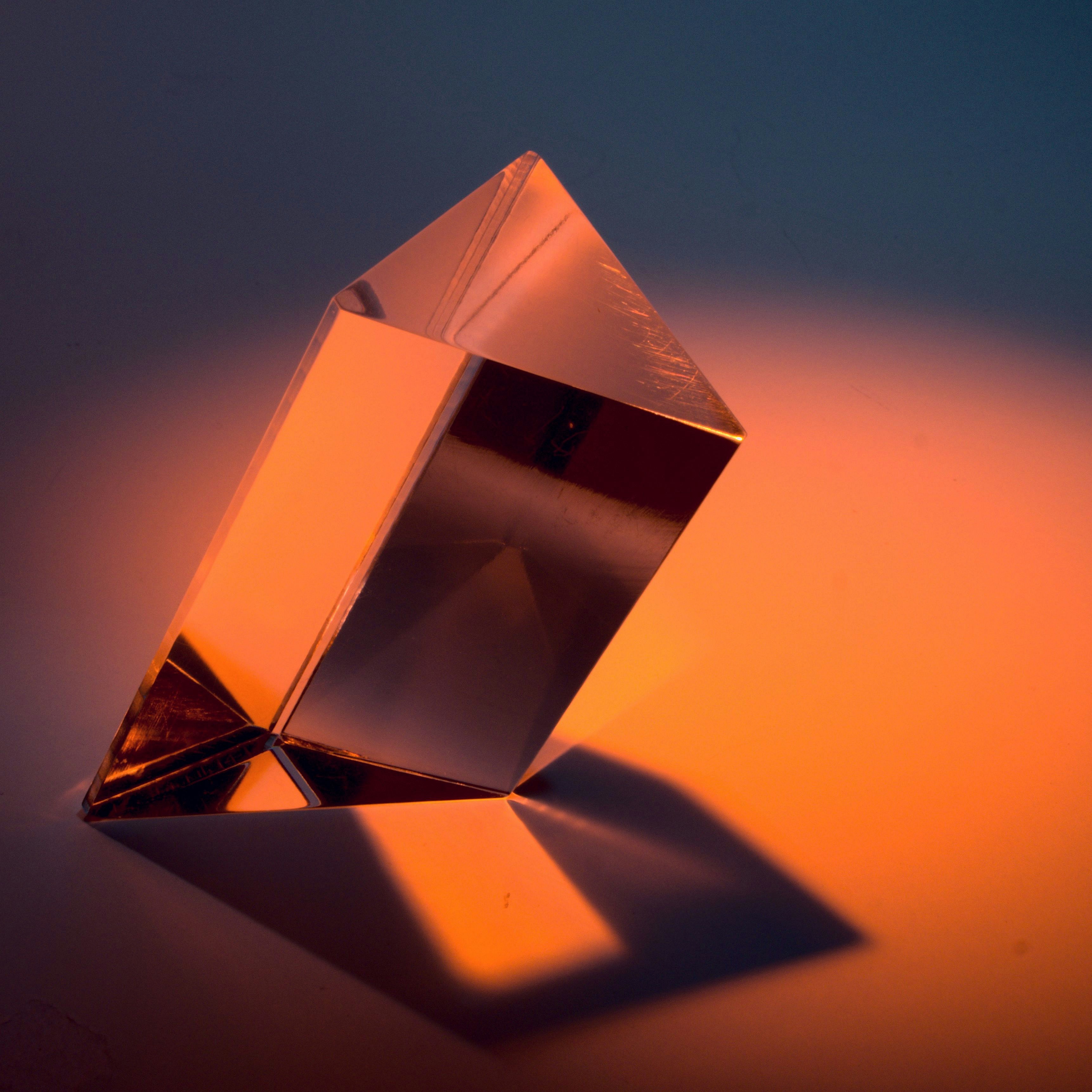 A shiny glass object sitting on a table photo – Free Jewelry Image on ...