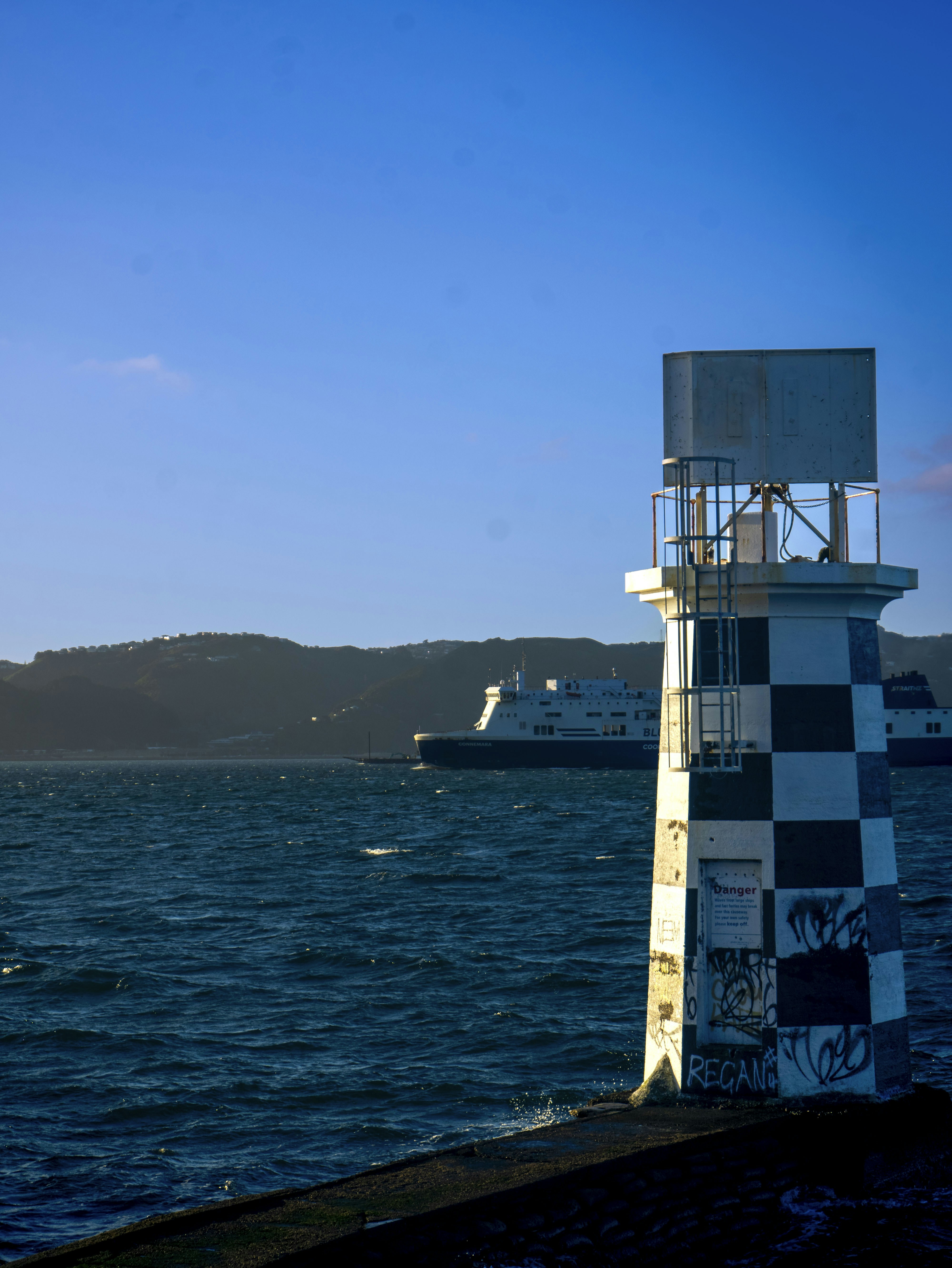 Checkered Beacon at the Edge of the Sea