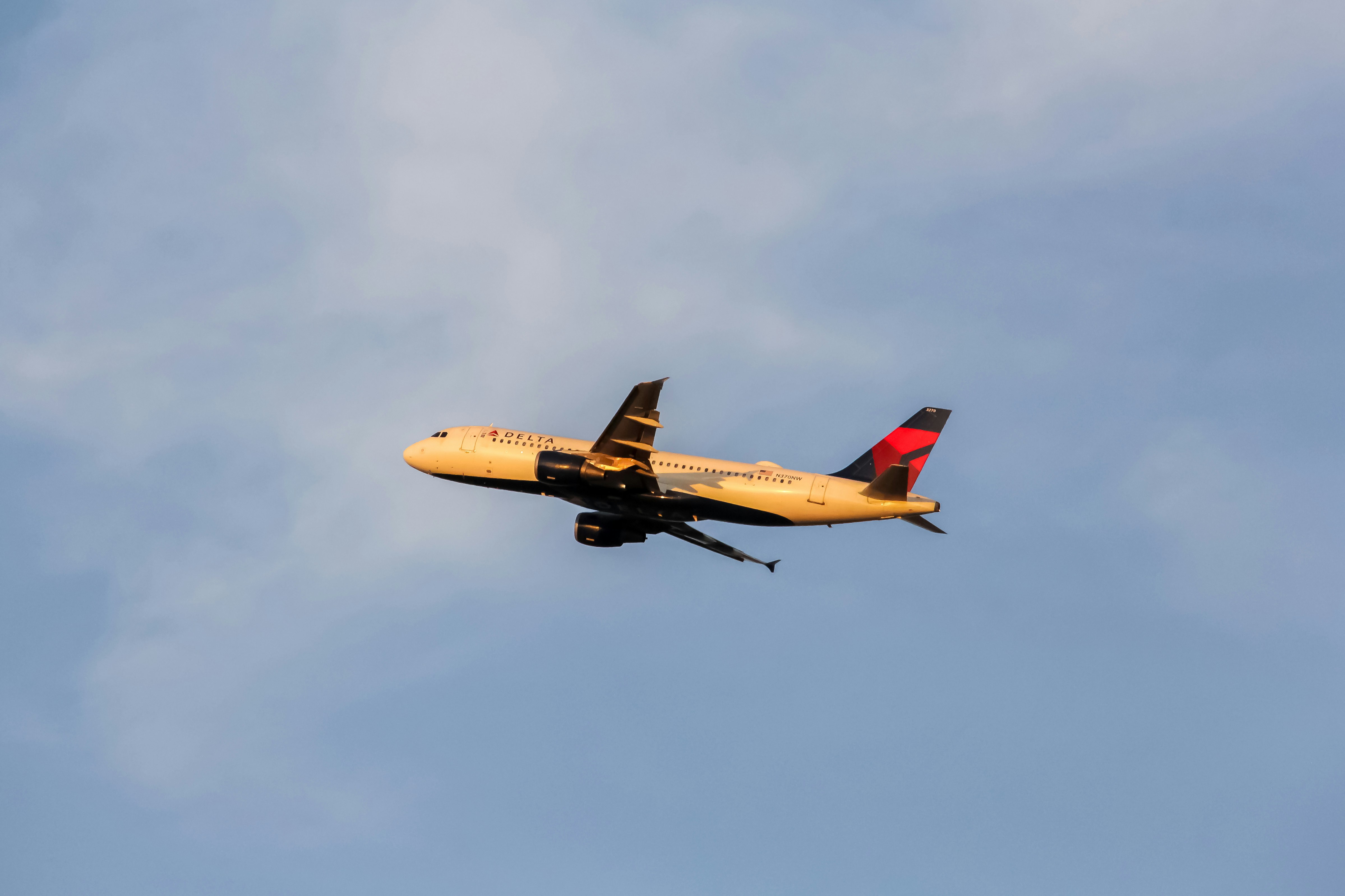 An airplane is flying in the sky on a sunny day photo – Free Dfw ...