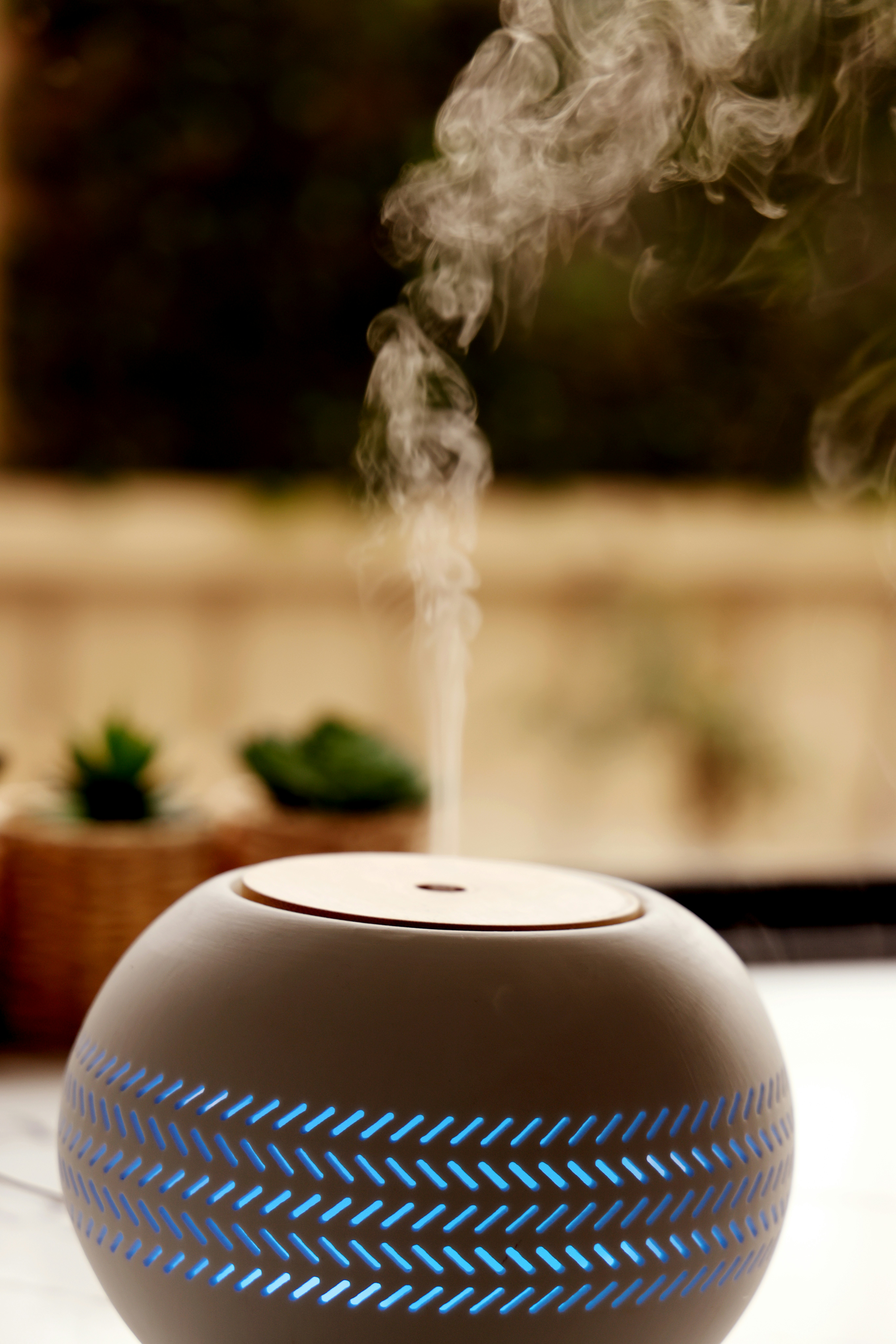 Indigo-Chevron Diffuser: Steam Drifts Over a Sunlit Terrace