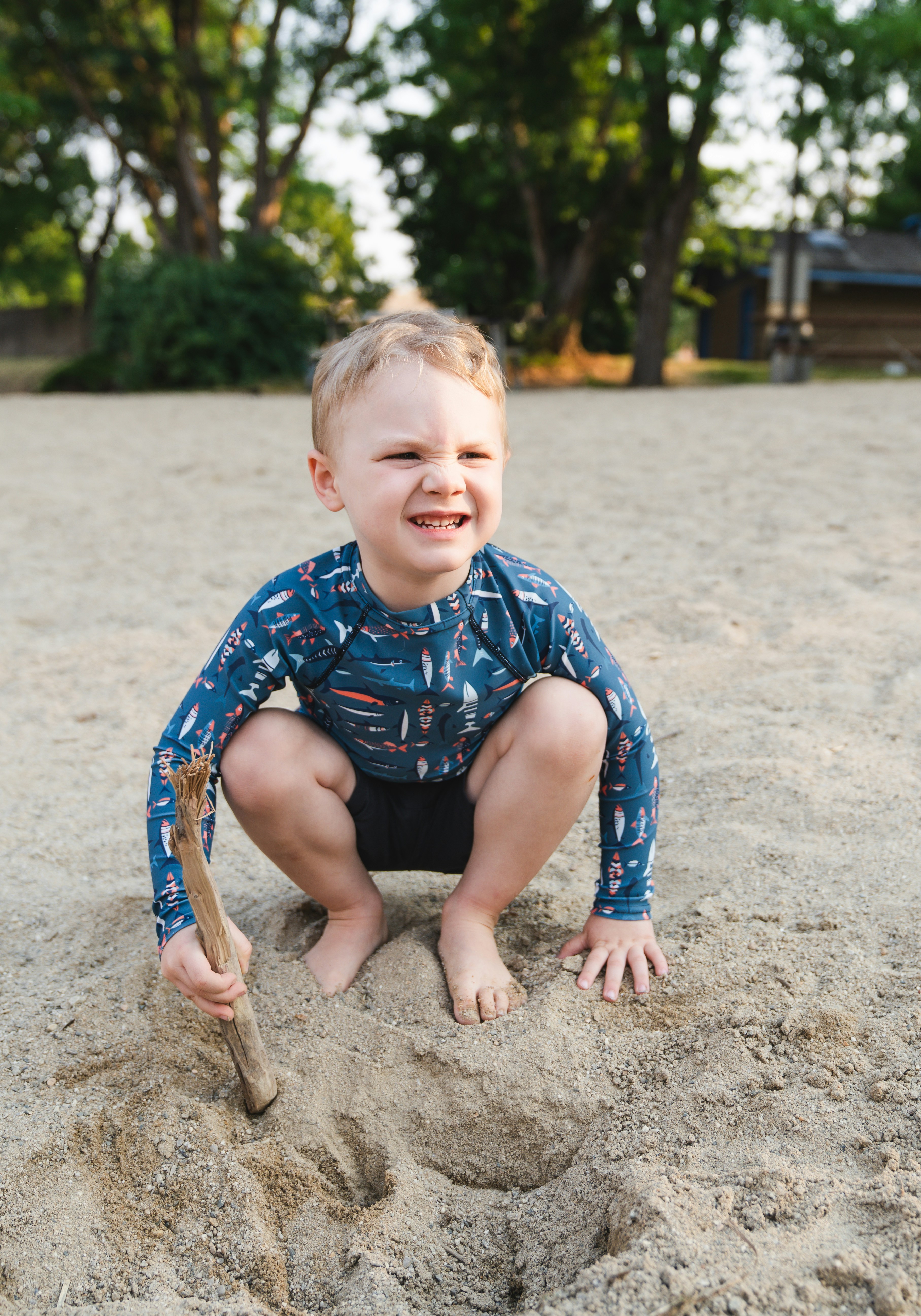 A little boy playing in the sand with a baseball bat photo – Free Beach ...