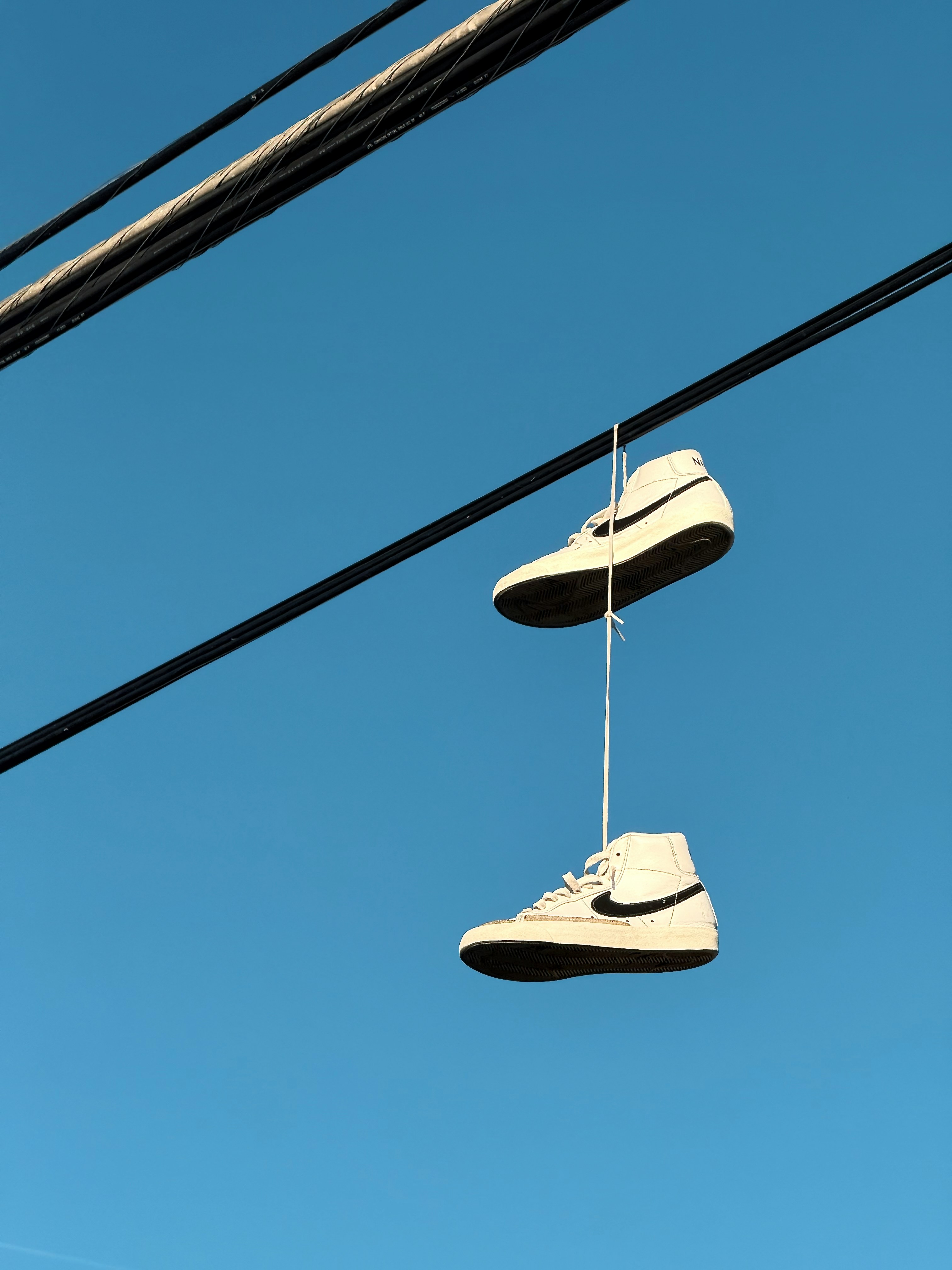 A pair of shoes hanging from a power line photo – Free Dallas Image on ...