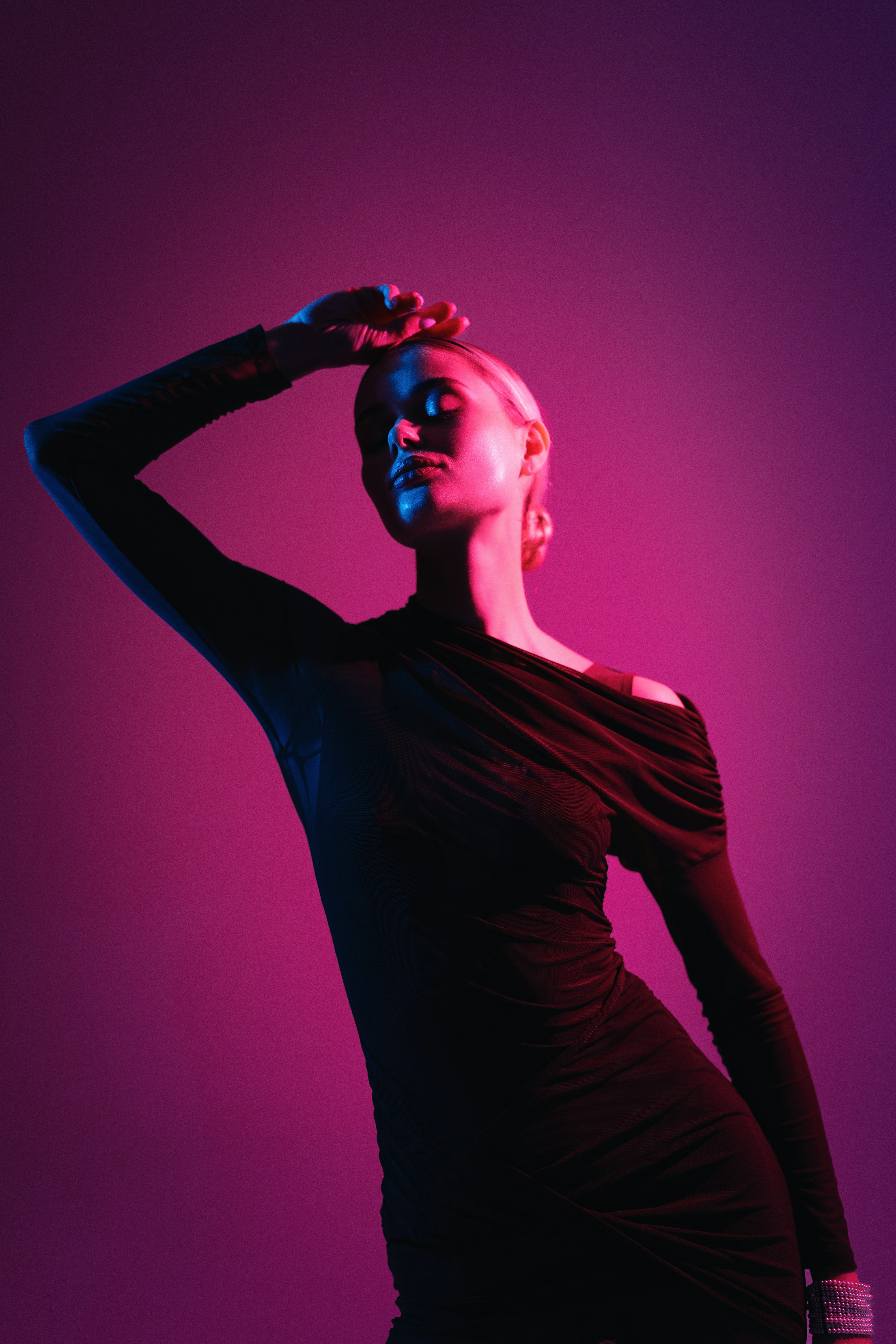 A woman in a black dress posing for a picture photo – Free Female model ...