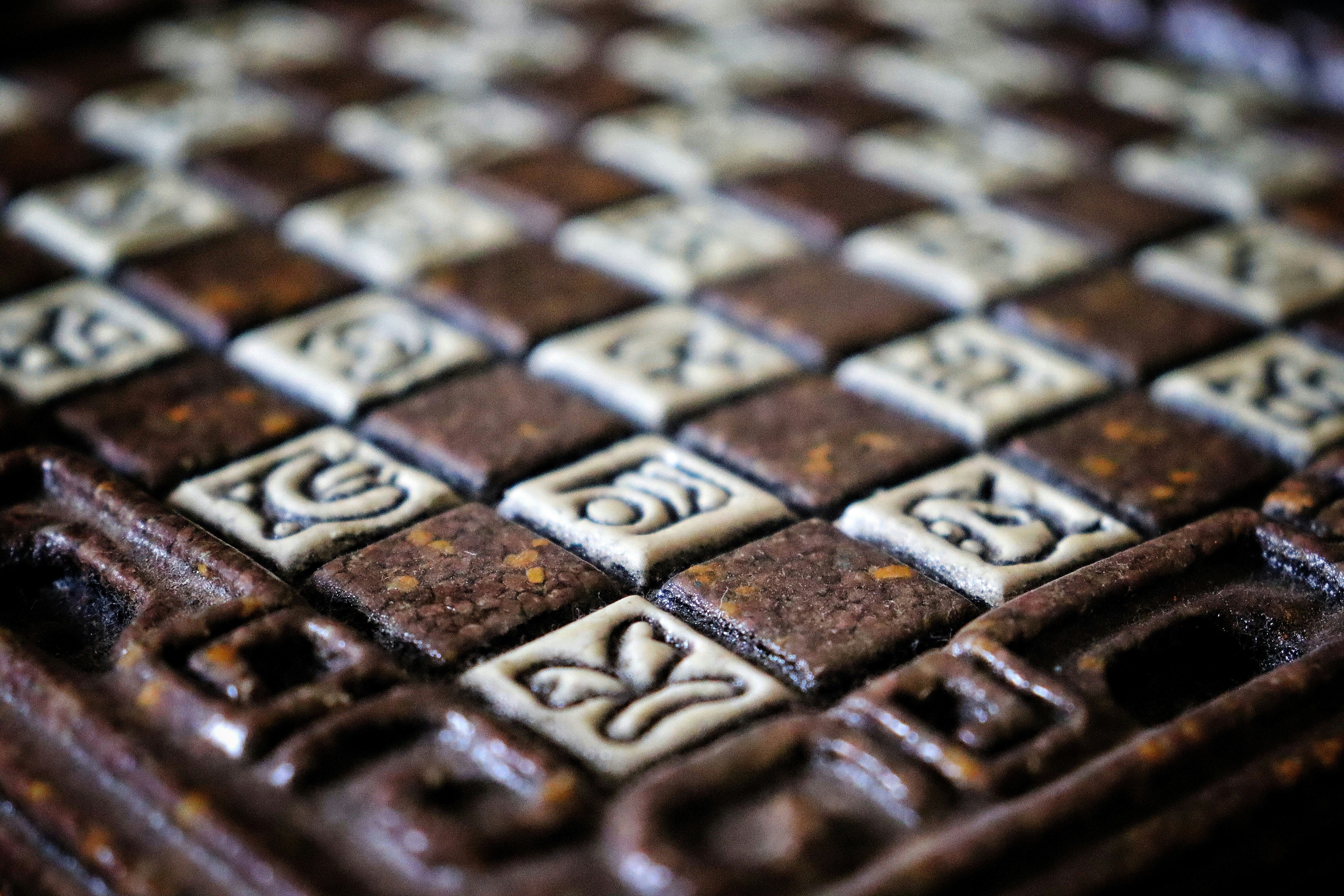 Rusty Mosaic Macro: Close-Up on Embossed Tile Squares