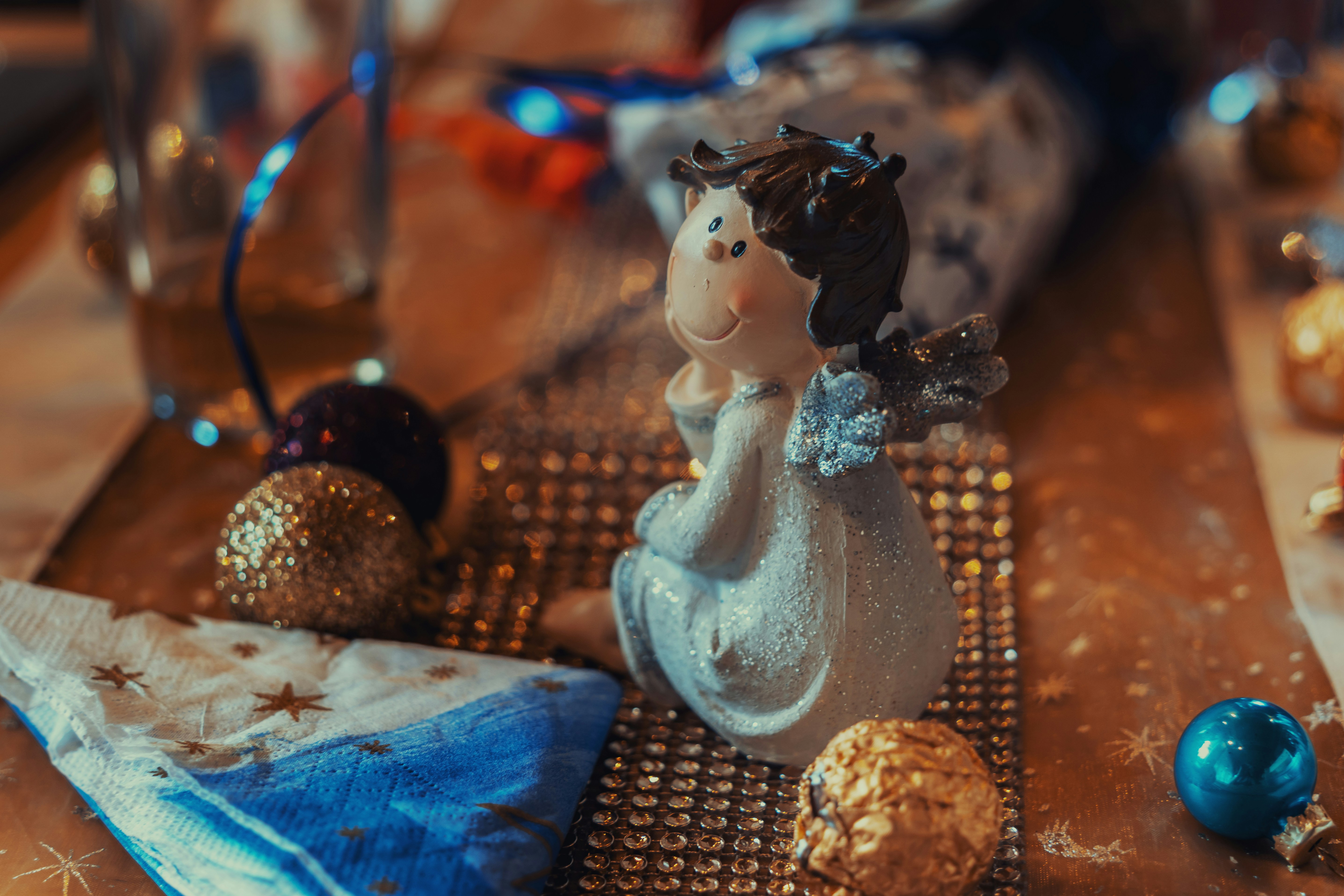 Ceramic Angel Amid Glittering Holidays: A Quiet Centerpiece