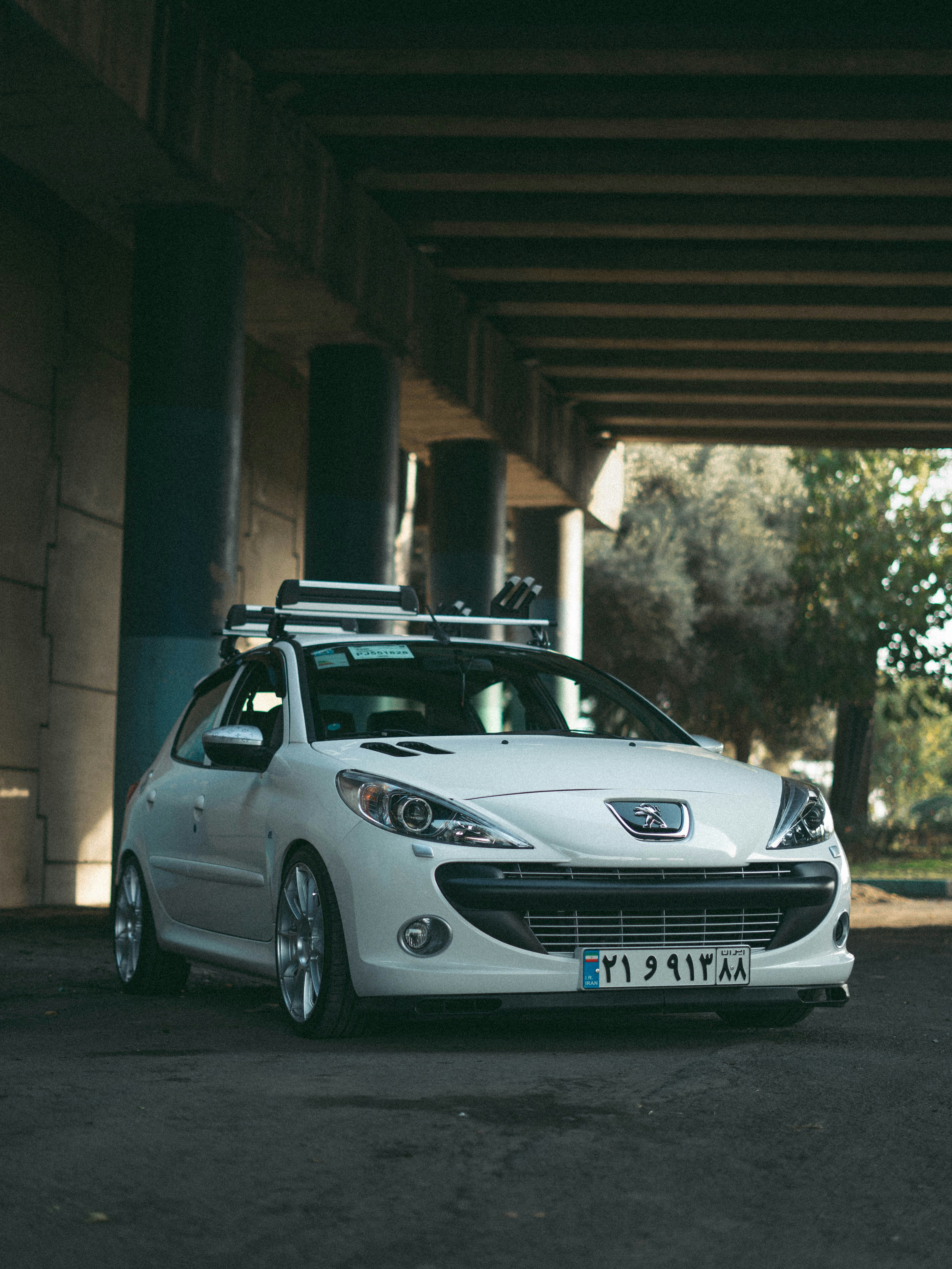White Peugeot Ragtop Under the Bridge Ready for Adventure