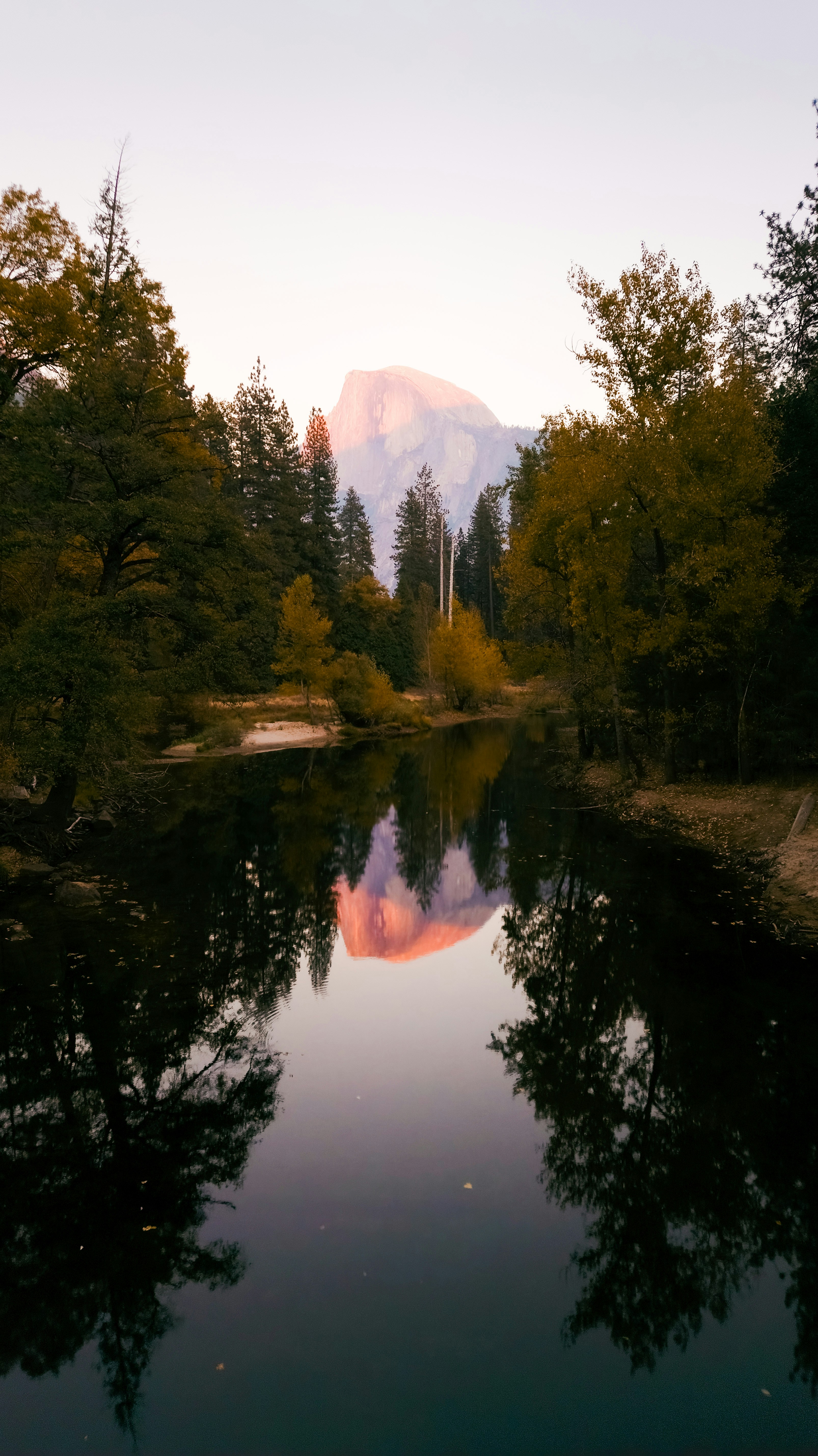 Twin Peaks in Still Waters under Golden Light