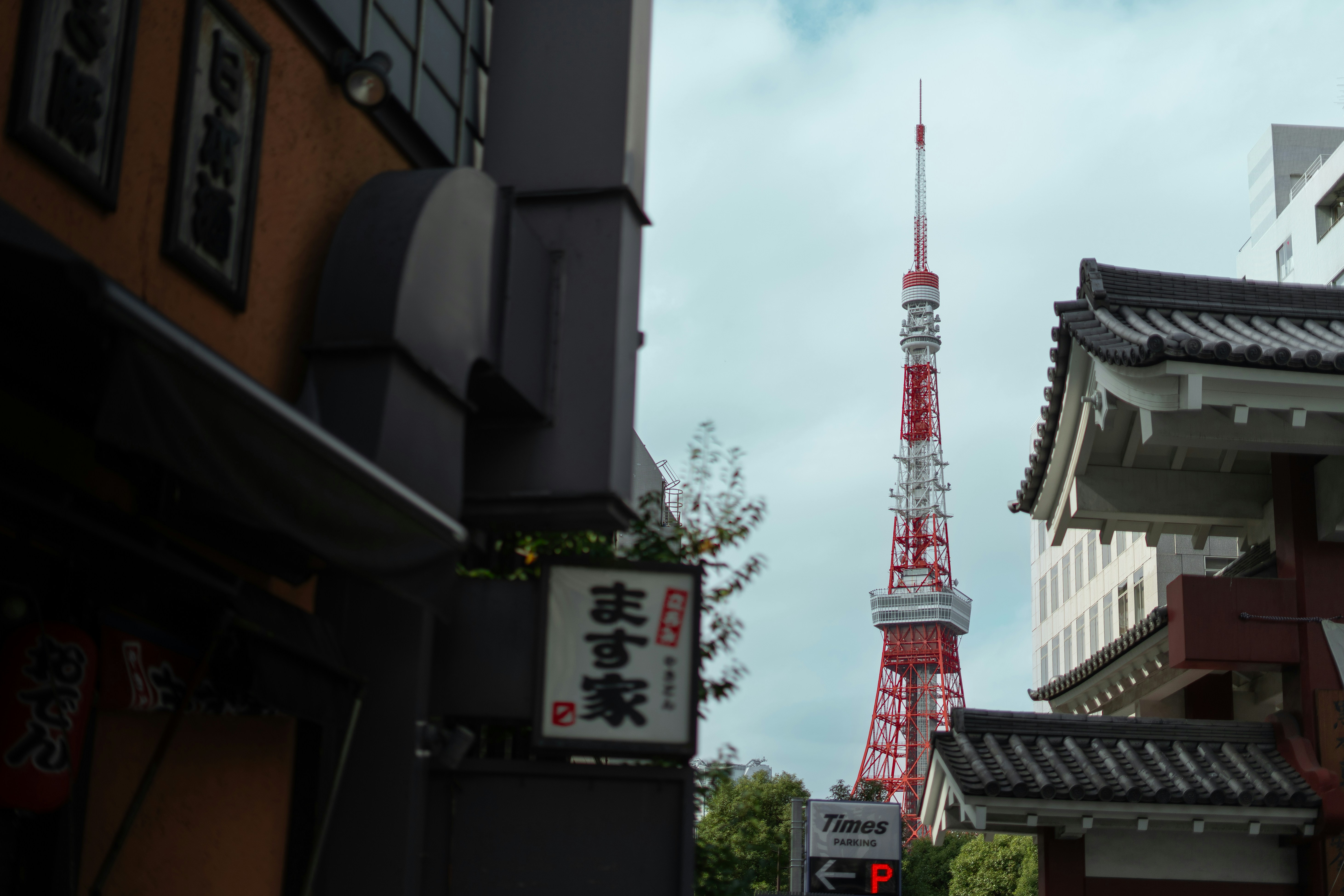 A tall red and white tower towering over a city photo – Free Tokyo ...