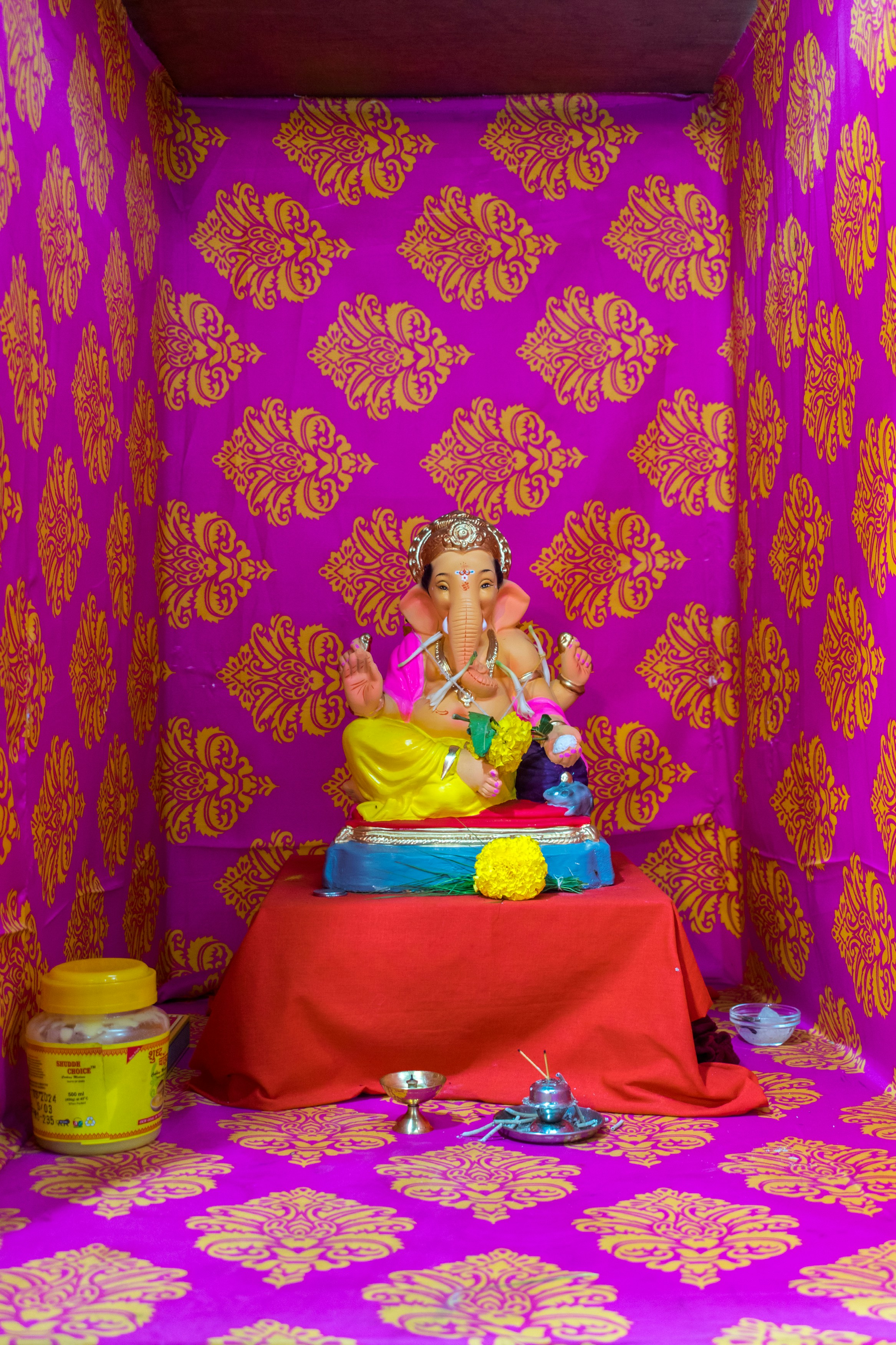 There is a small statue in the corner of a room photo – Free Ganesh ...
