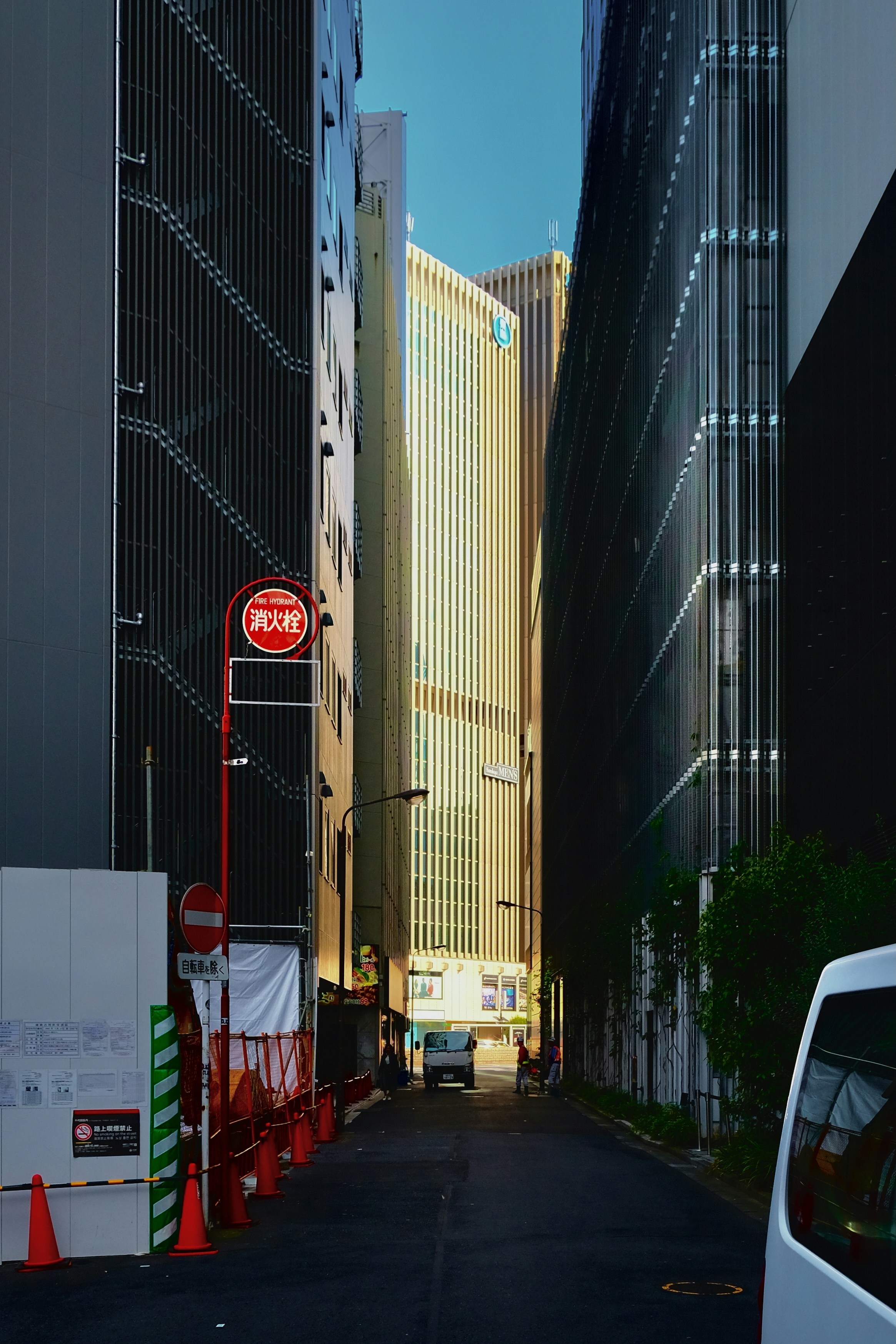 Urban Canyon: Sunlit Golden Tower at the Alley End