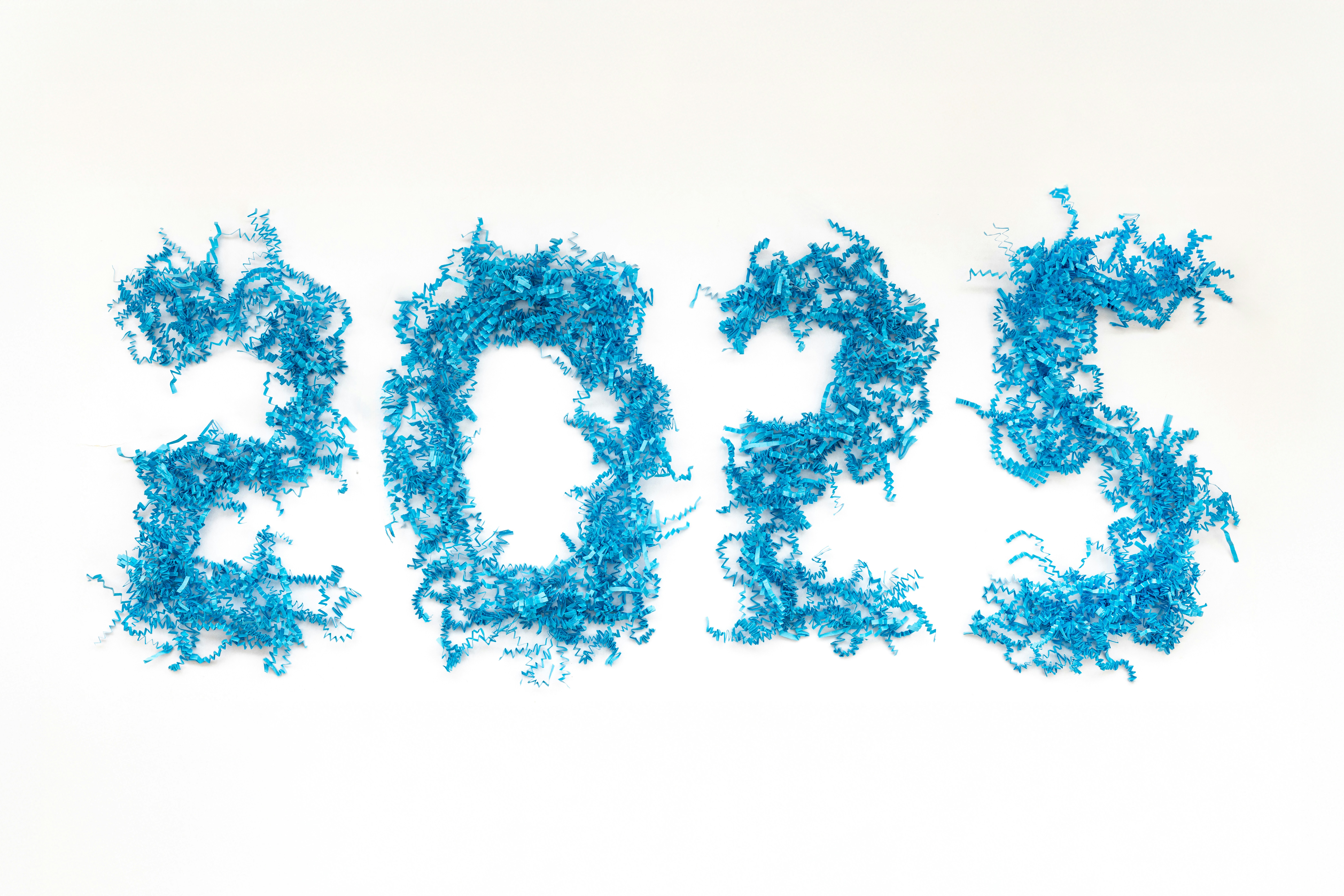 New year, 2025. The numbers 2025 written in blue packing material and set against a white background.