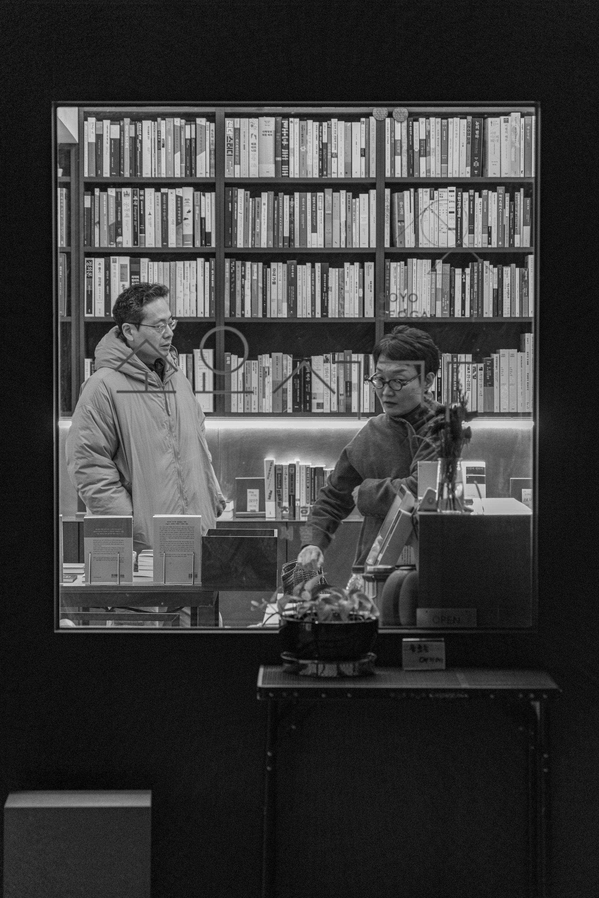 Through the Glass: Two Librarians in Quiet Focus