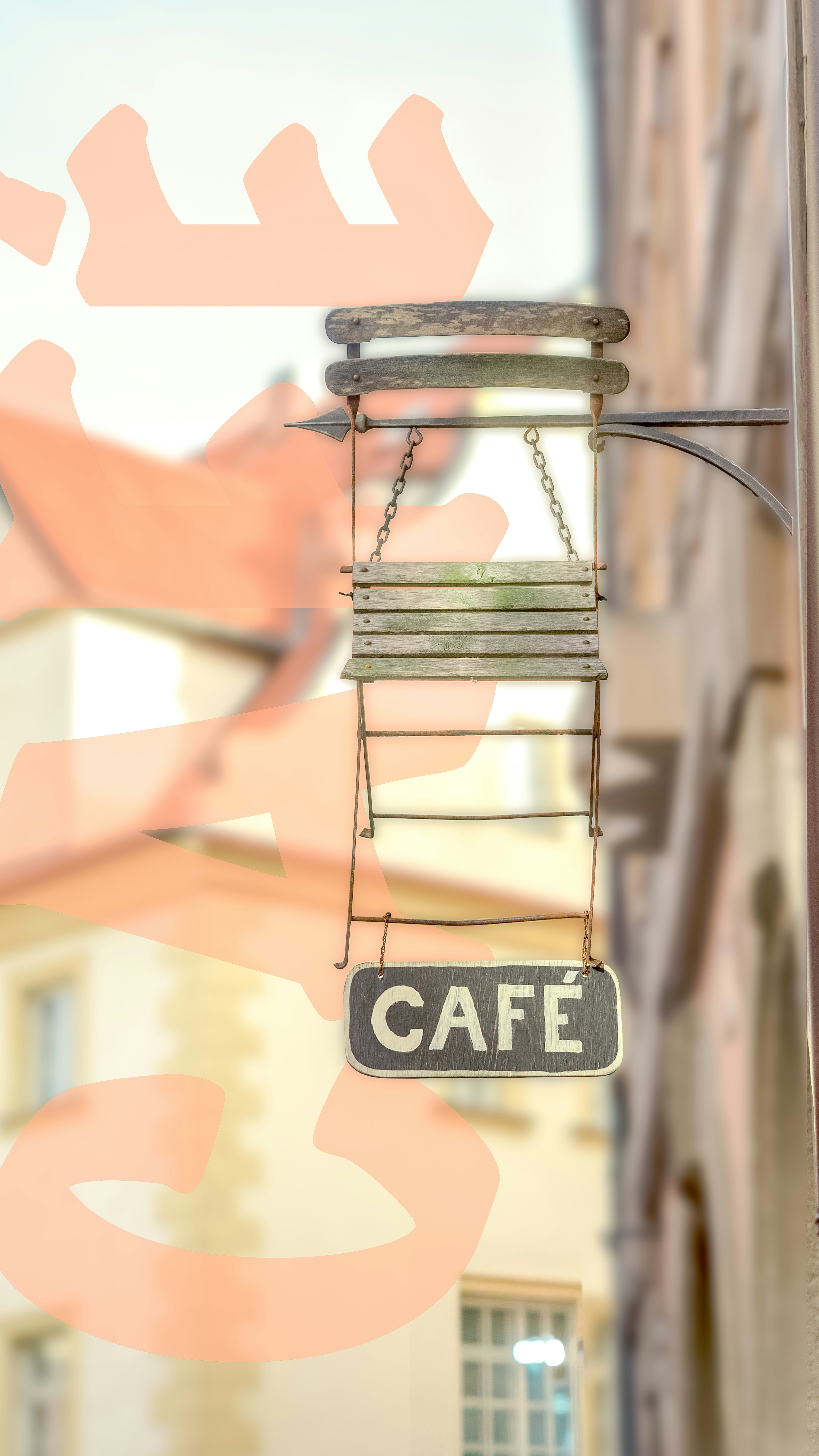 Weathered Café Sign on Chains under a Gentle Urban Glow