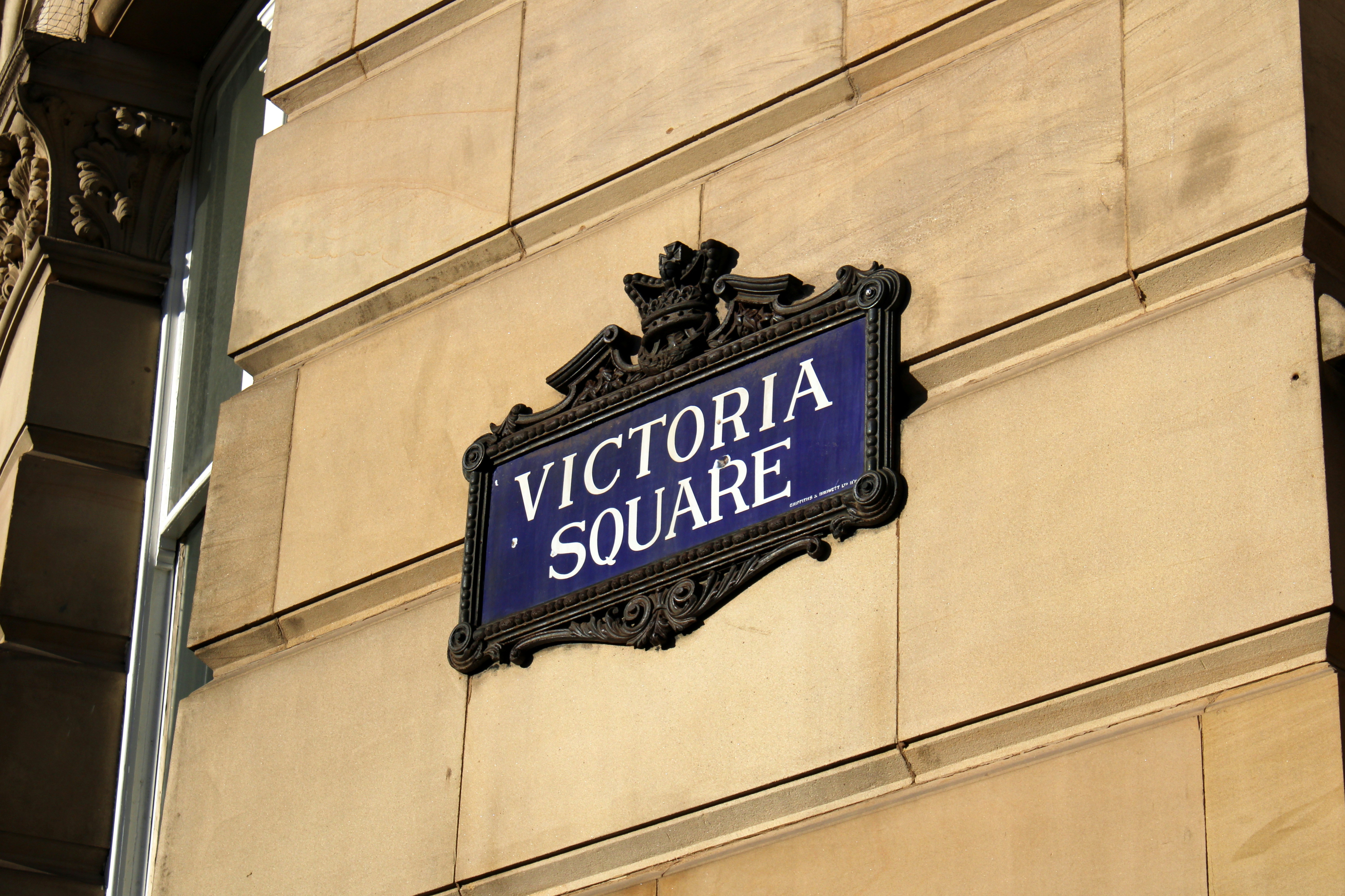 A sign on the side of a building that says victoria square photo – Free ...