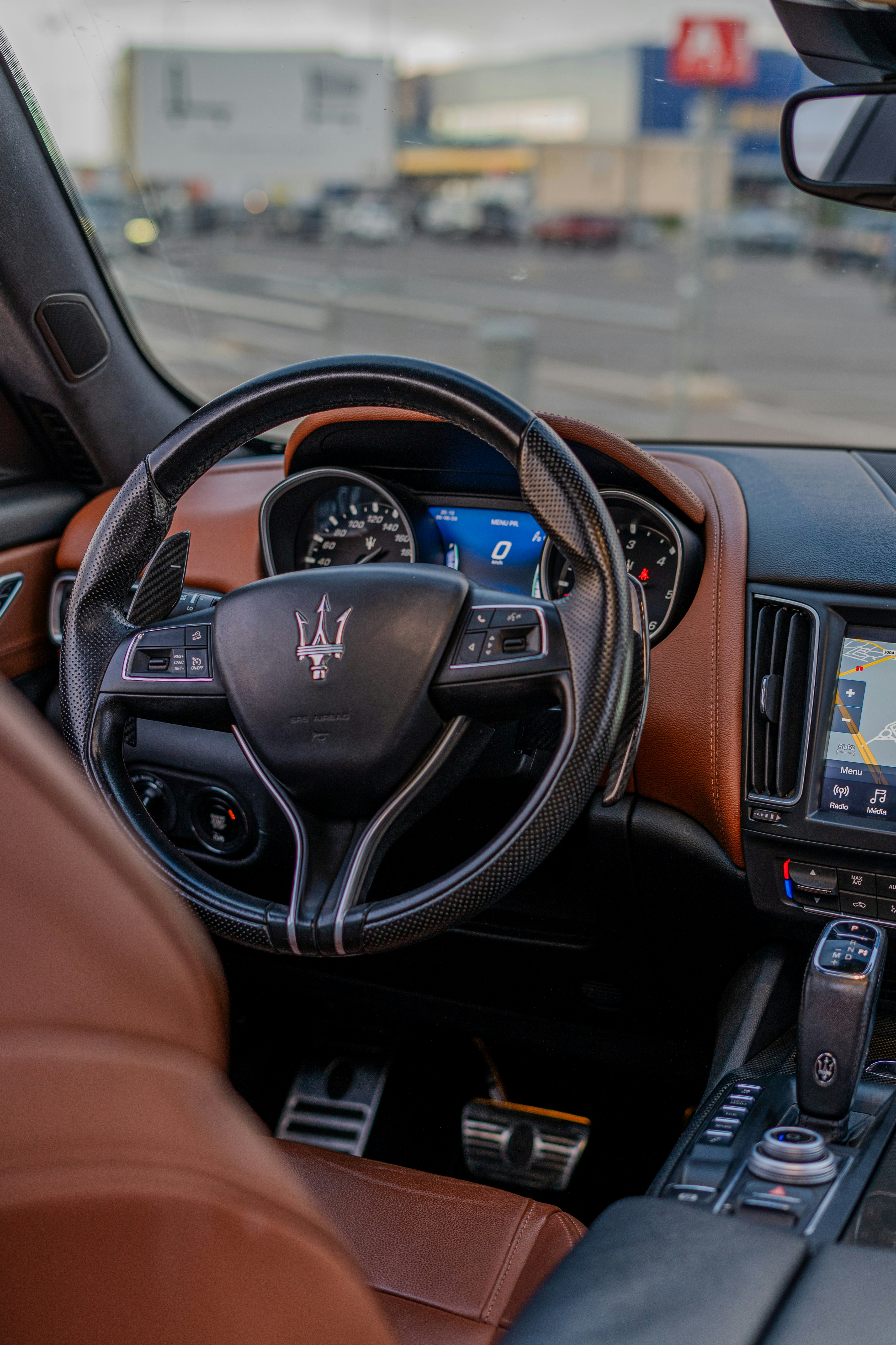 Maserati Cockpit: Carbon-Fiber Wheel Framing a Digital Dash