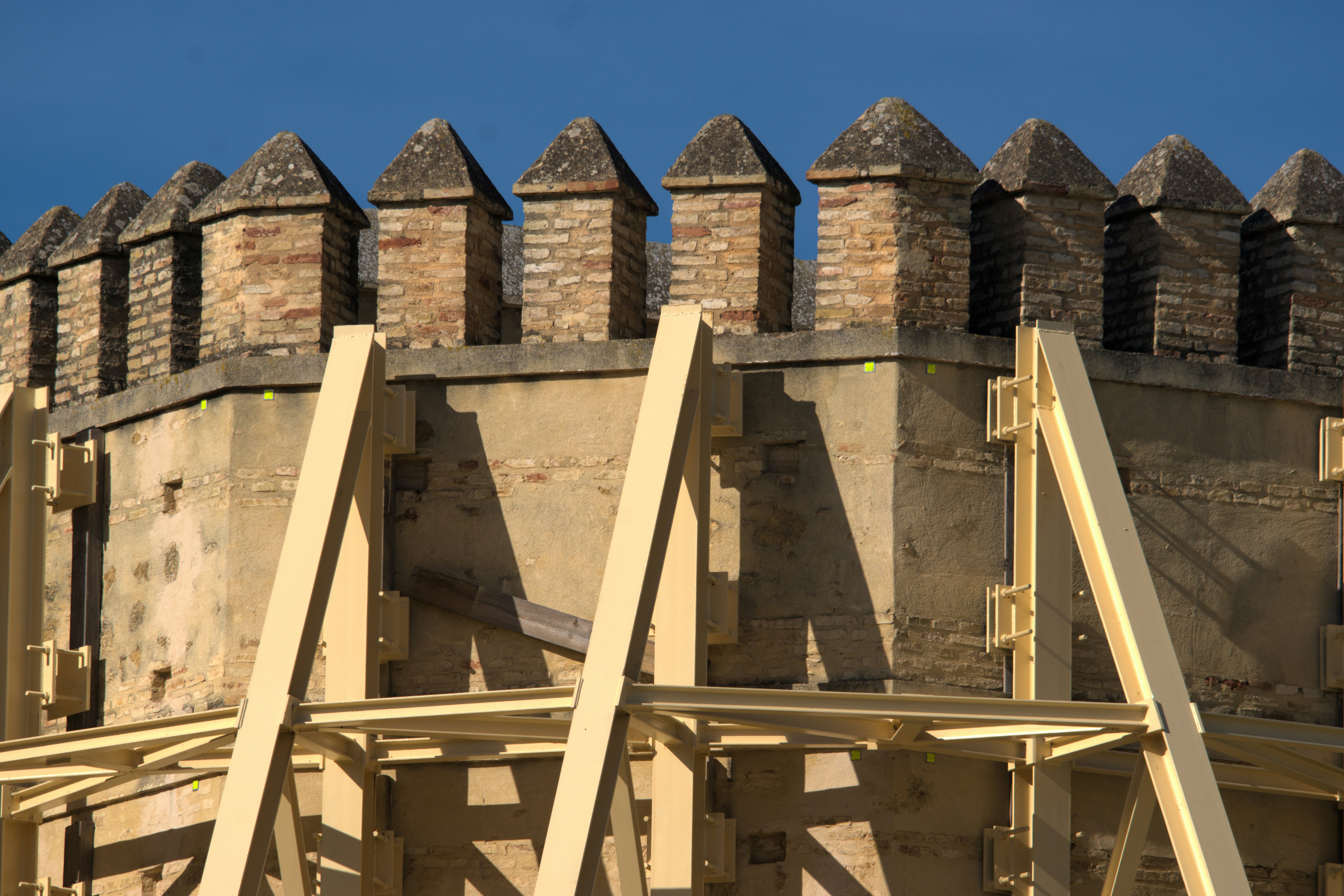 Blue Sky over the Fortress: Timber Scaffolding Framing Ancient Walls