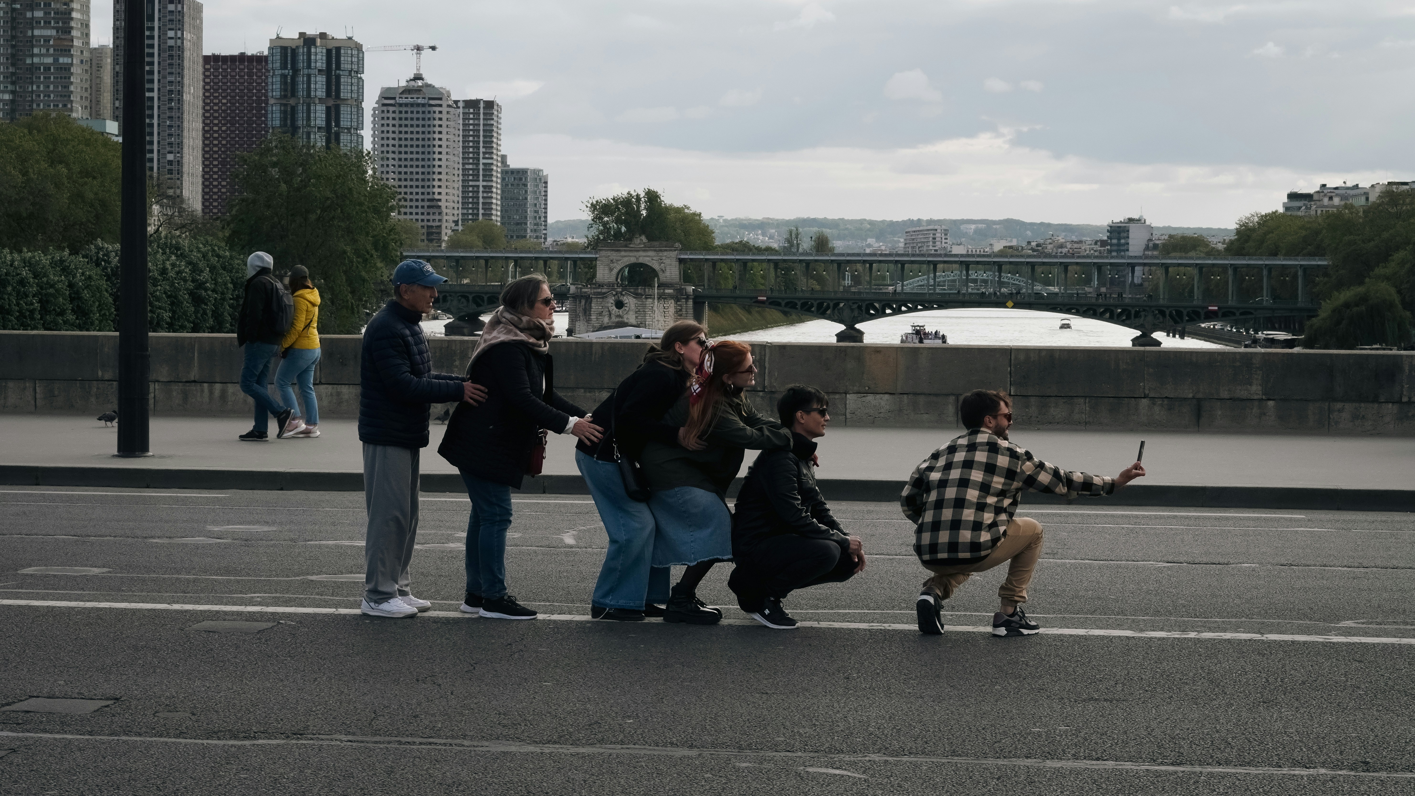 Urban Relay: Friends tug along a riverside sprint