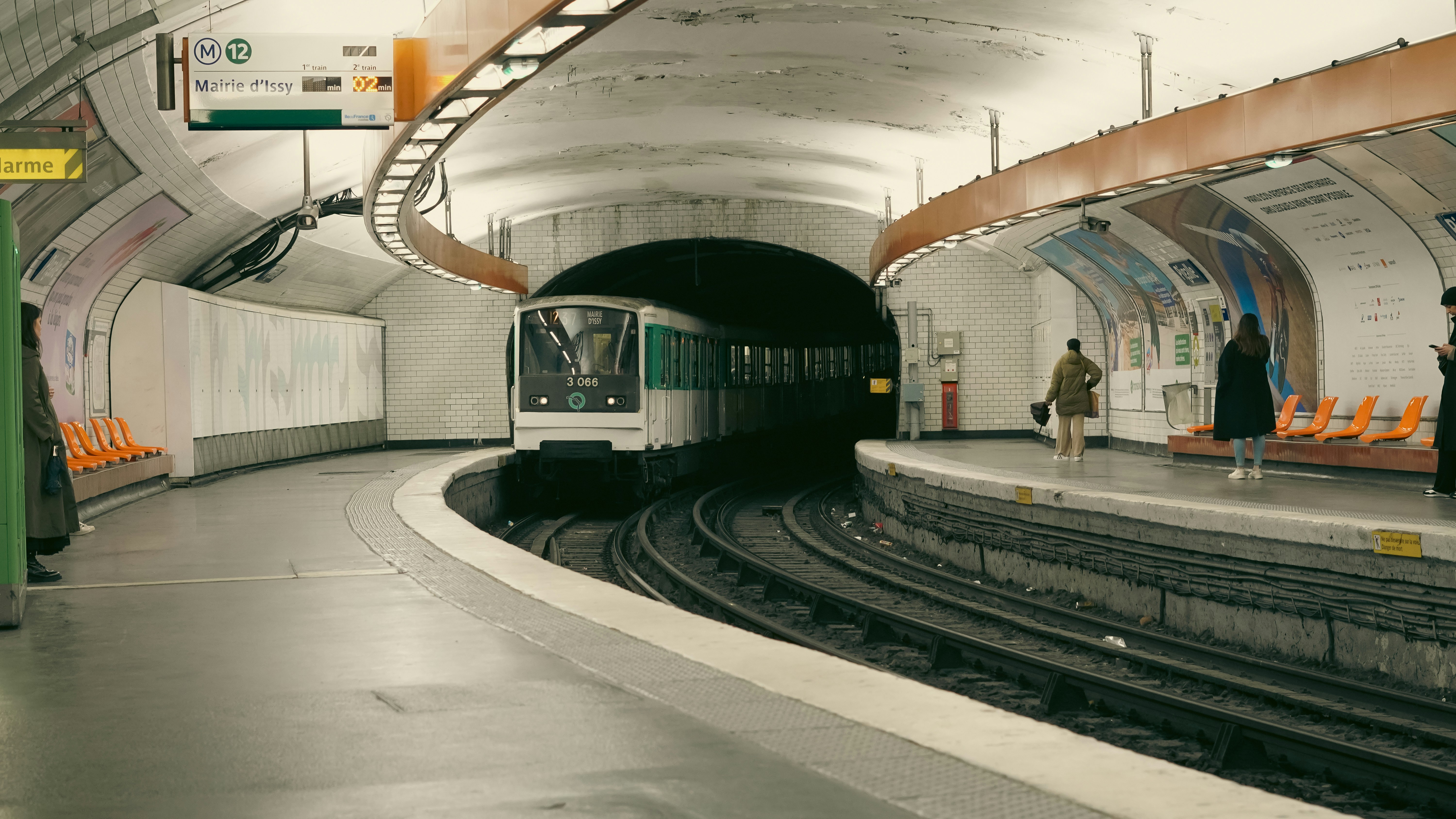 A subway train pulling into a subway station photo – Free Human Image ...