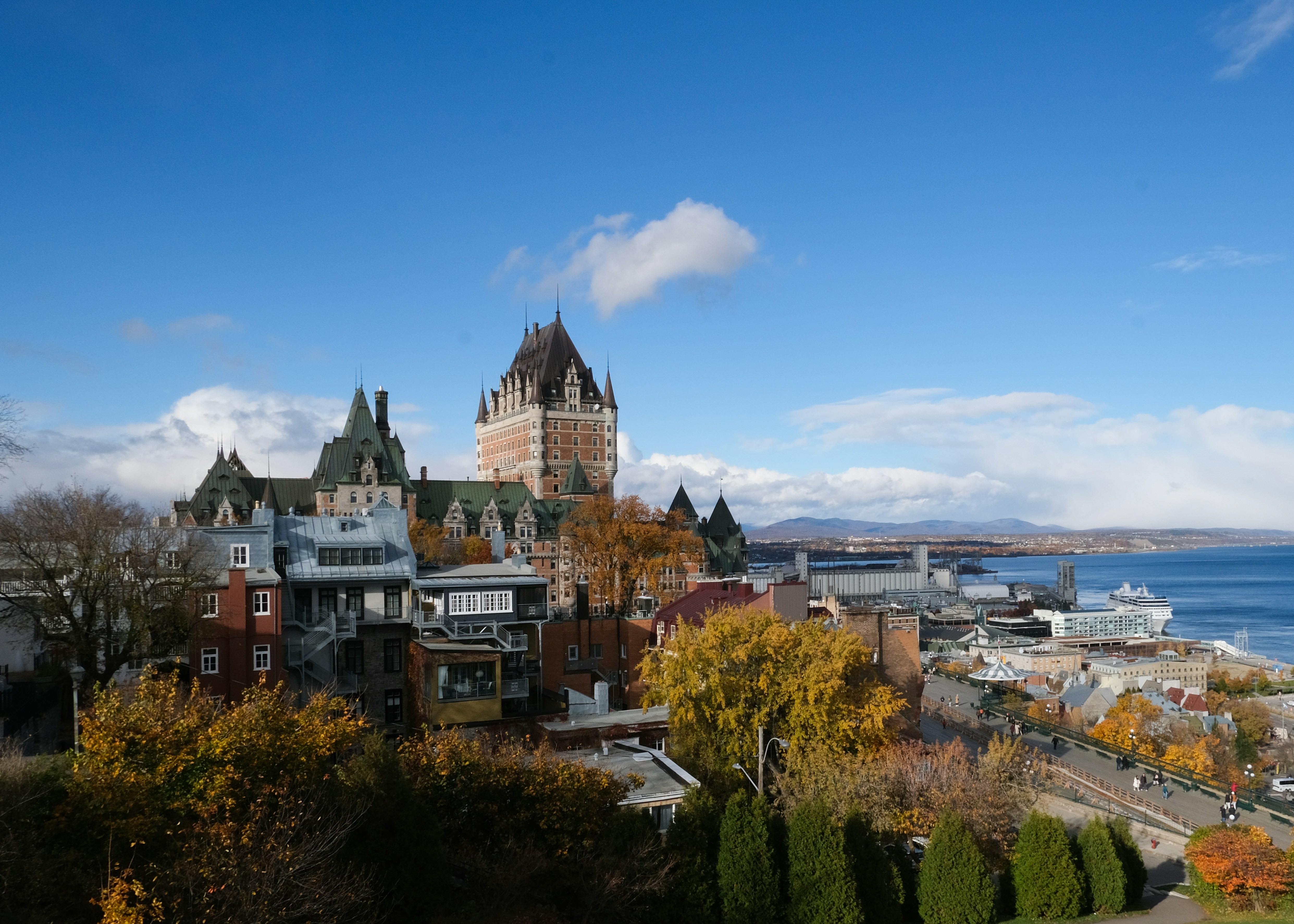 A scenic view of a city by the water photo – Free Québec city Image on ...