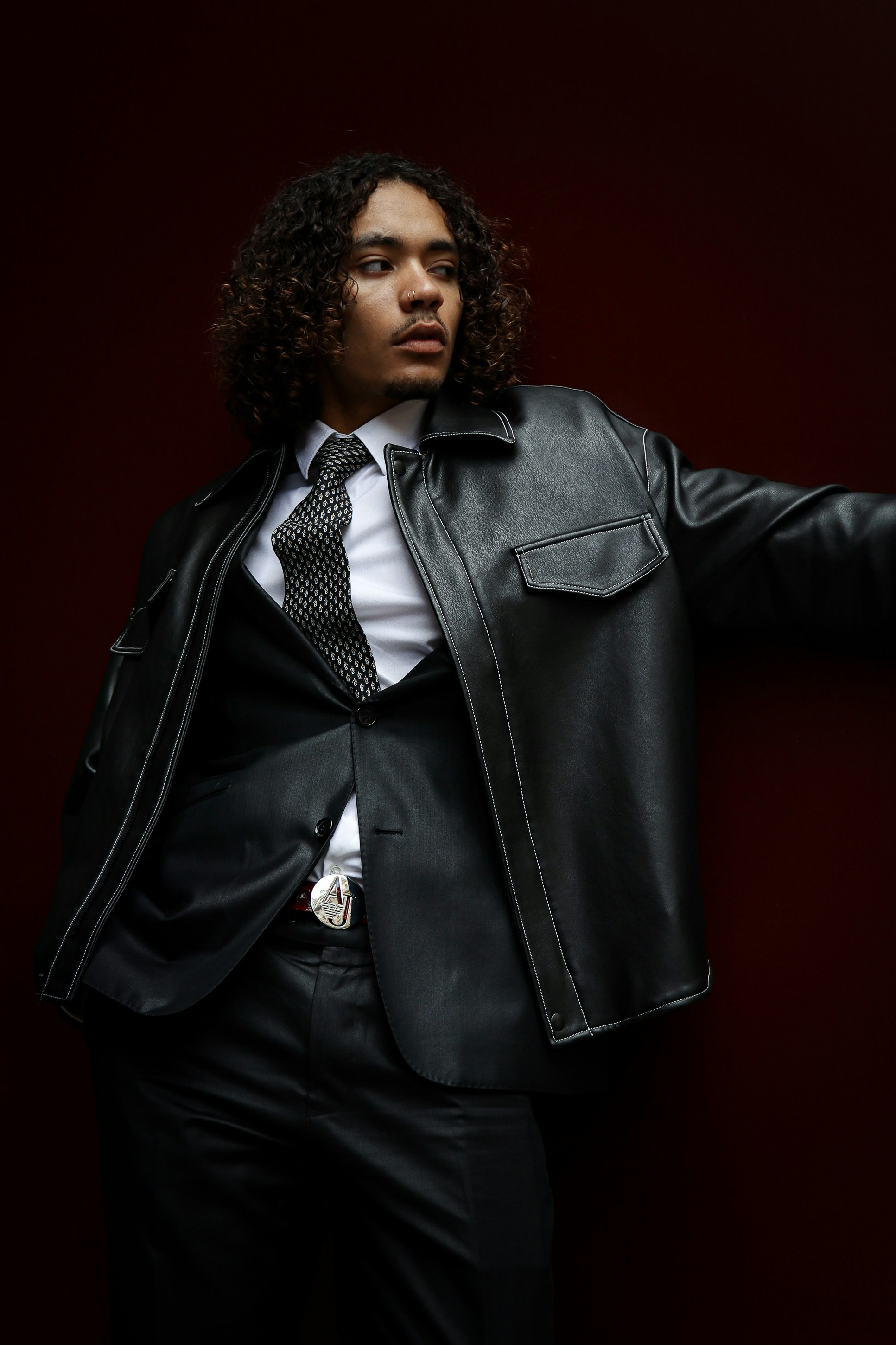 A man in a black suit and tie