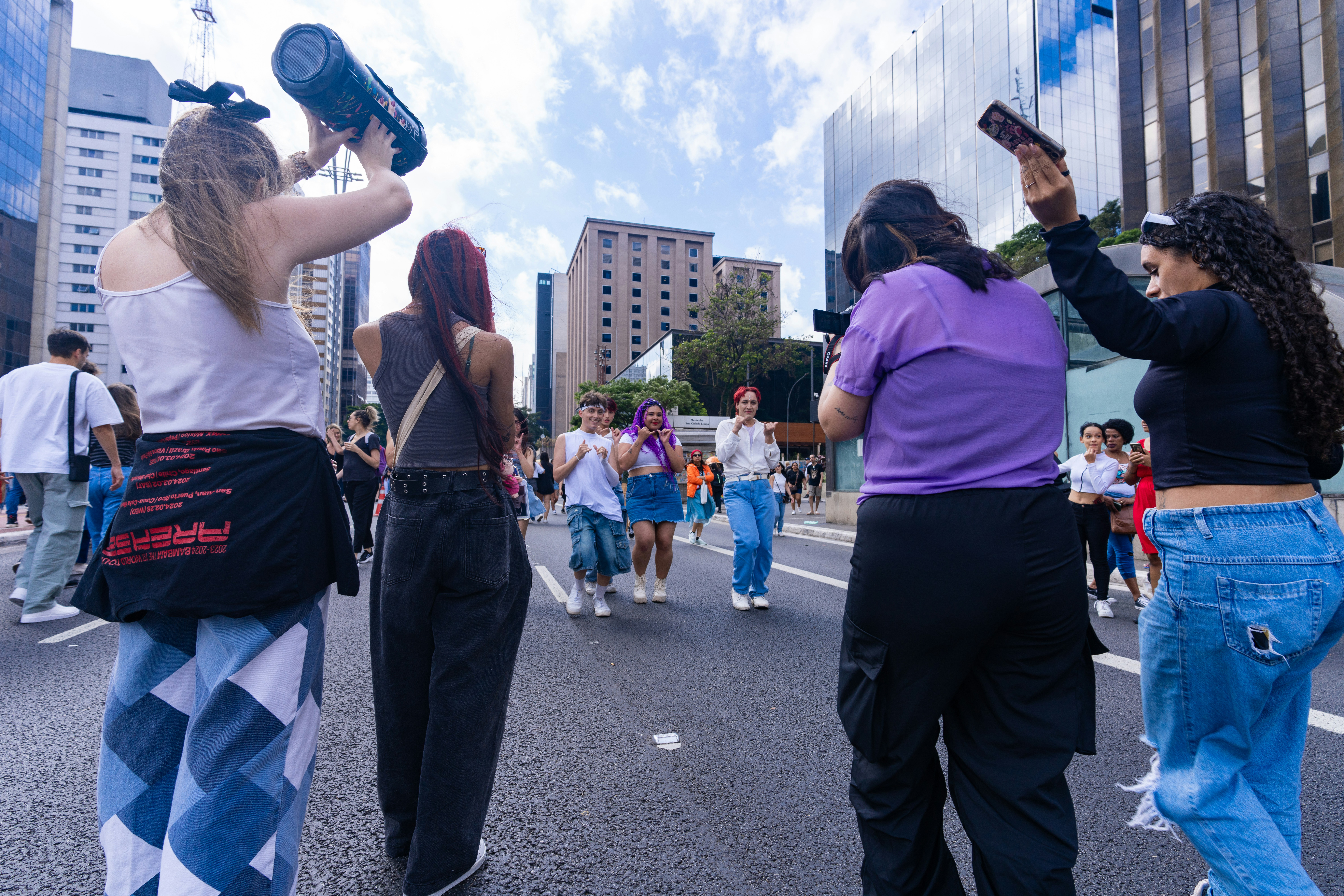 Marching Scene: A City Street Crowd Follows a Central Speaker