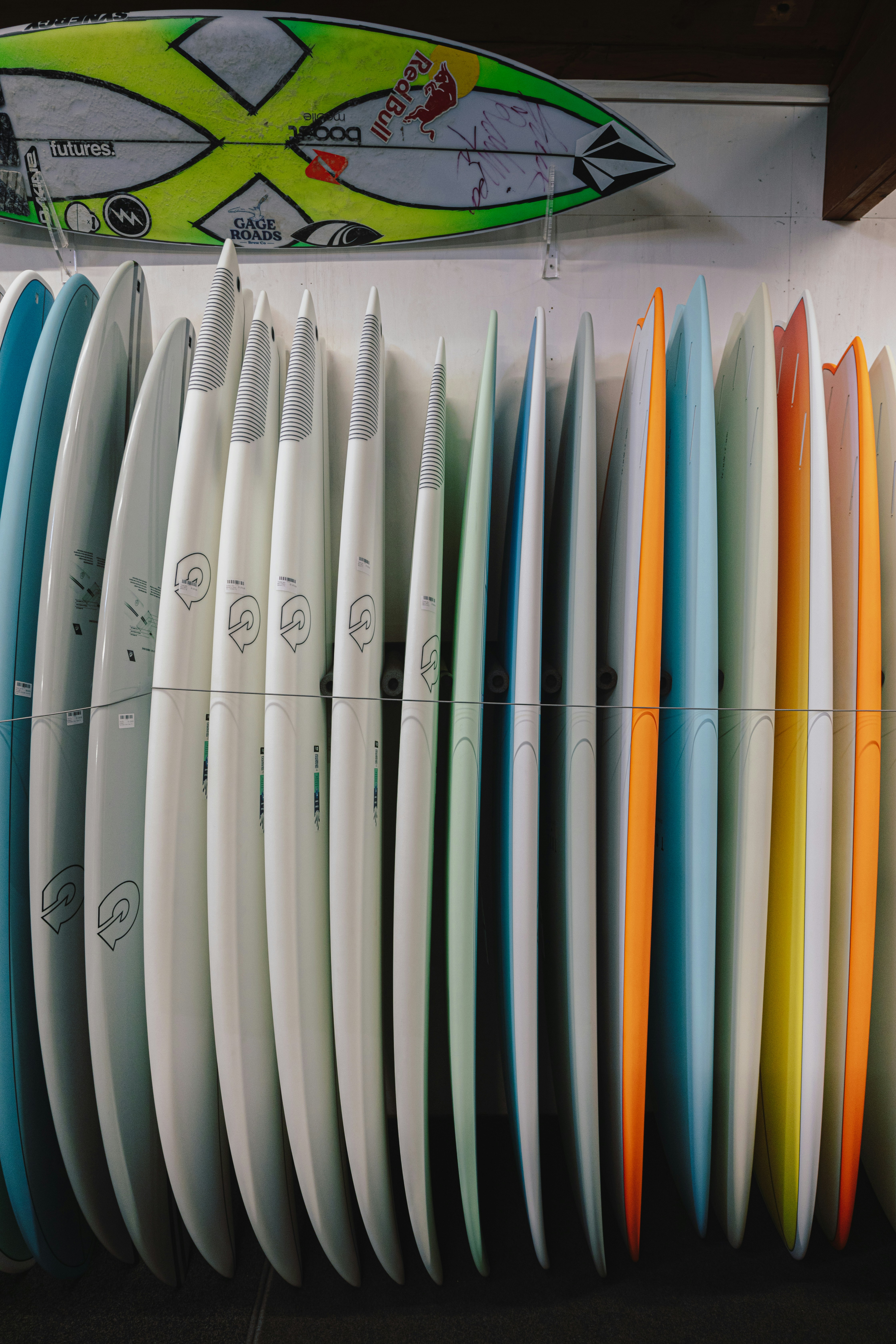 A bunch of surfboards are stacked on a rack photo – Free Raglan Image ...