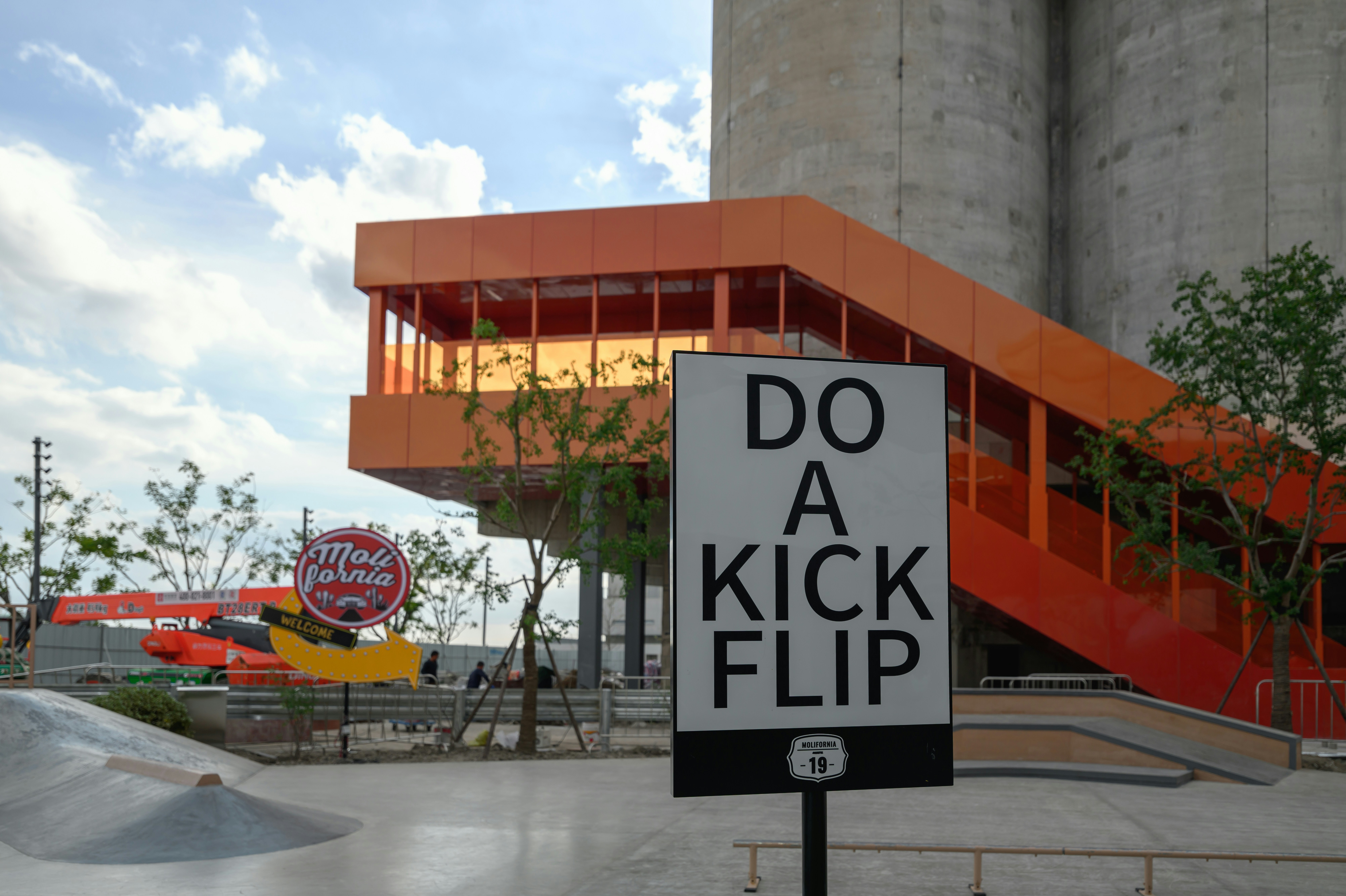 A do a kick flip sign in front of a building photo – Free Outdoor Image ...