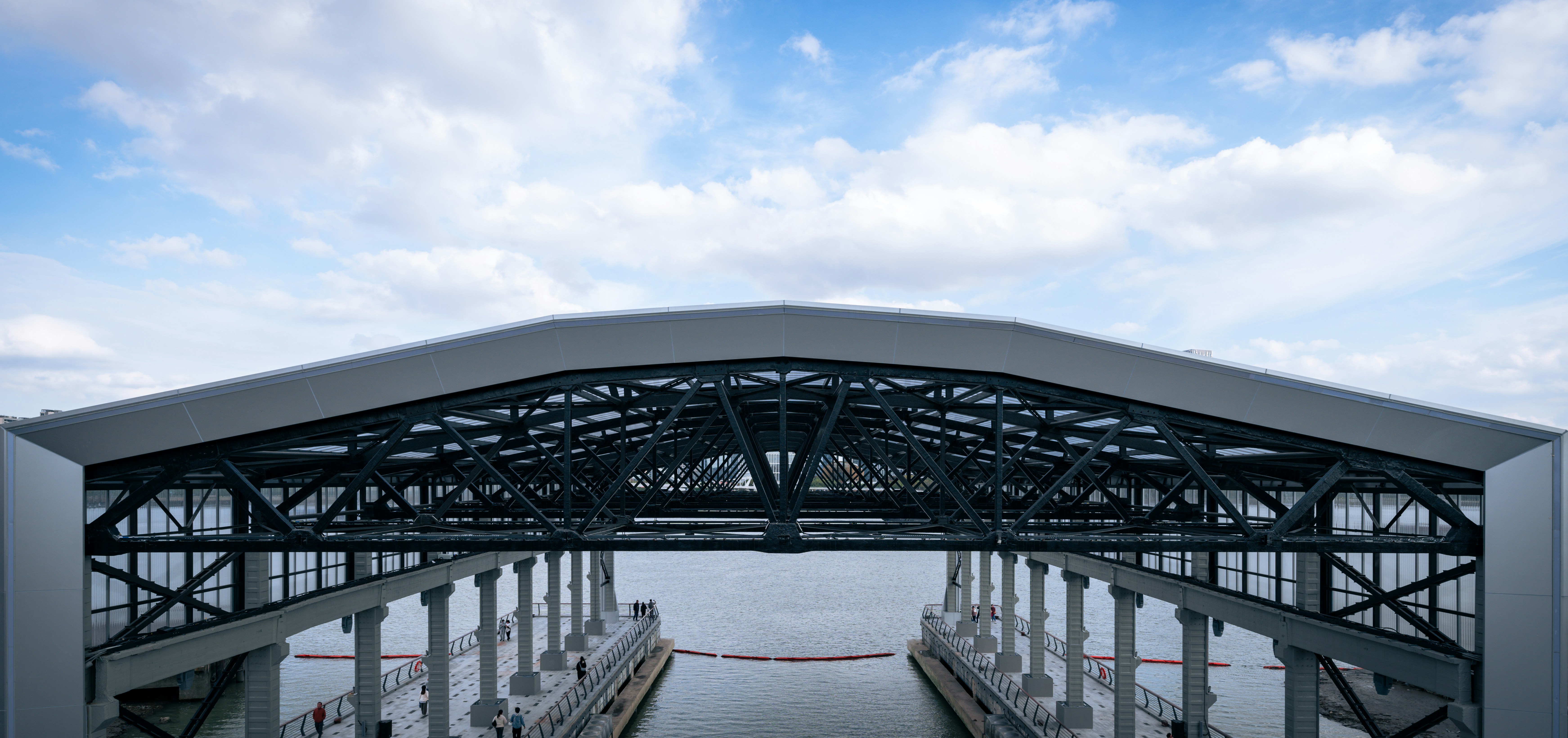 A large metal bridge over a body of water photo – Free Xuhui district ...