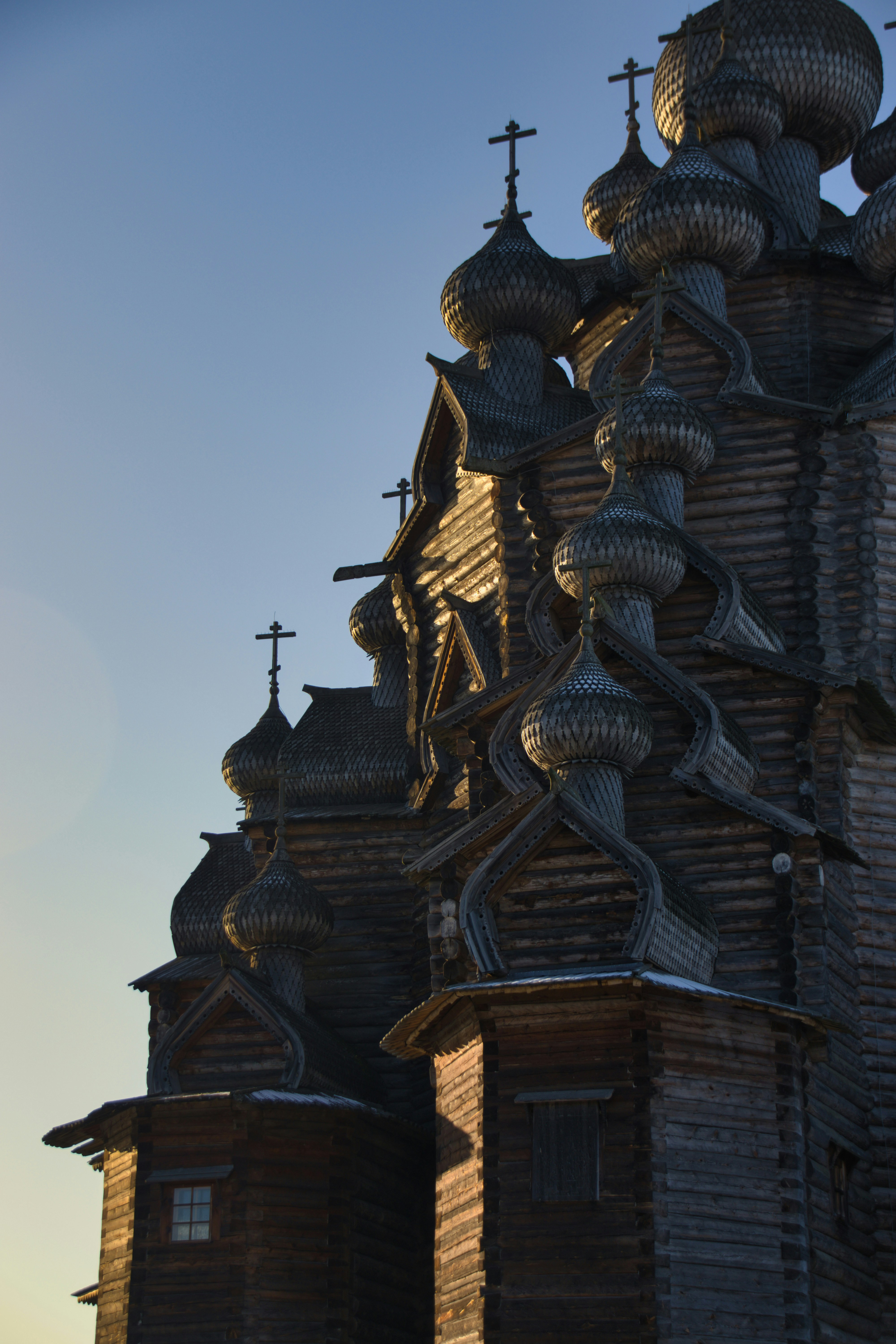 Dusk Light on Carved Timber: A Wooden Cathedral’s Onion Domes
