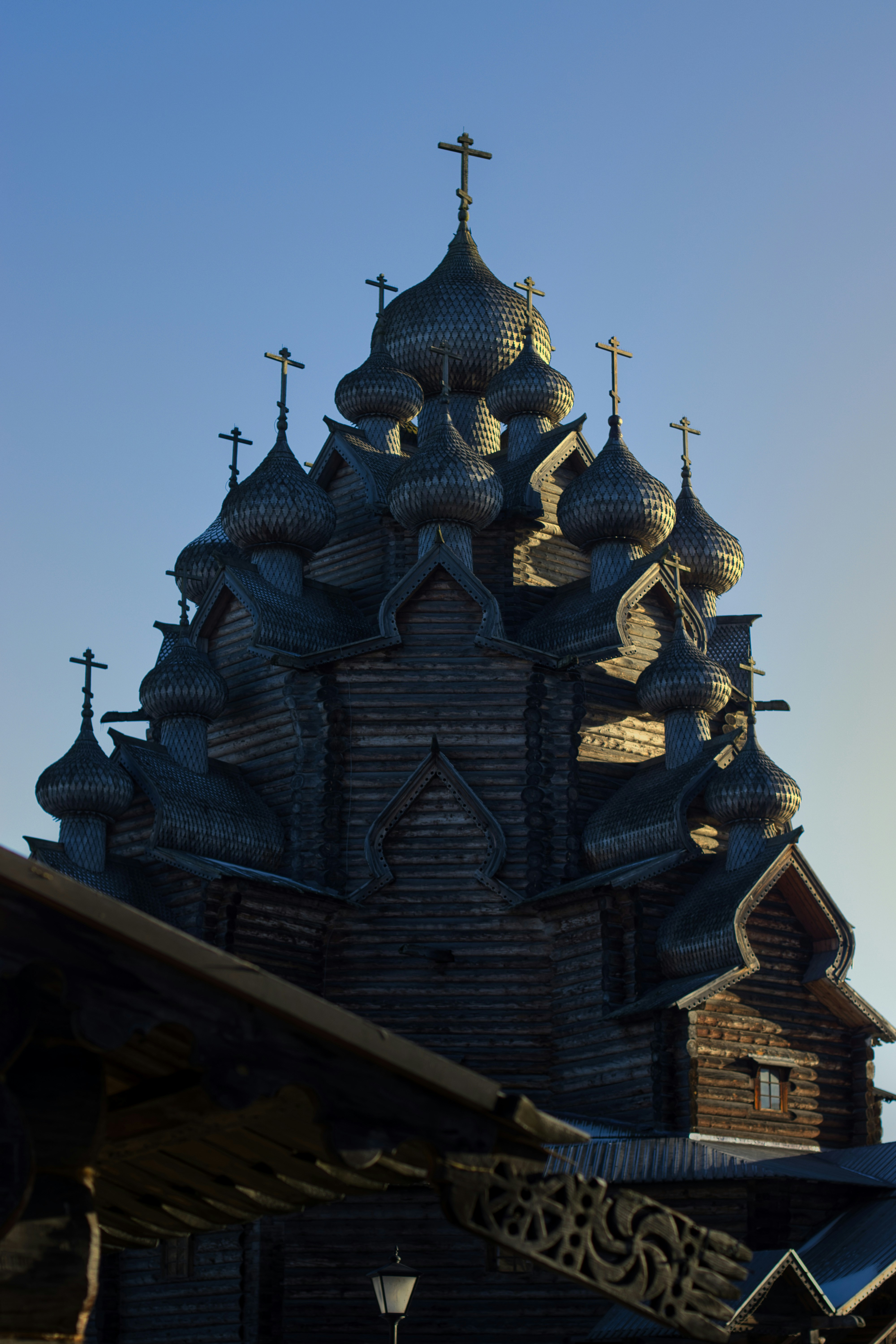 Timber Crowned Cathedral: A clustered onion-dome silhouette rising into cobalt sky