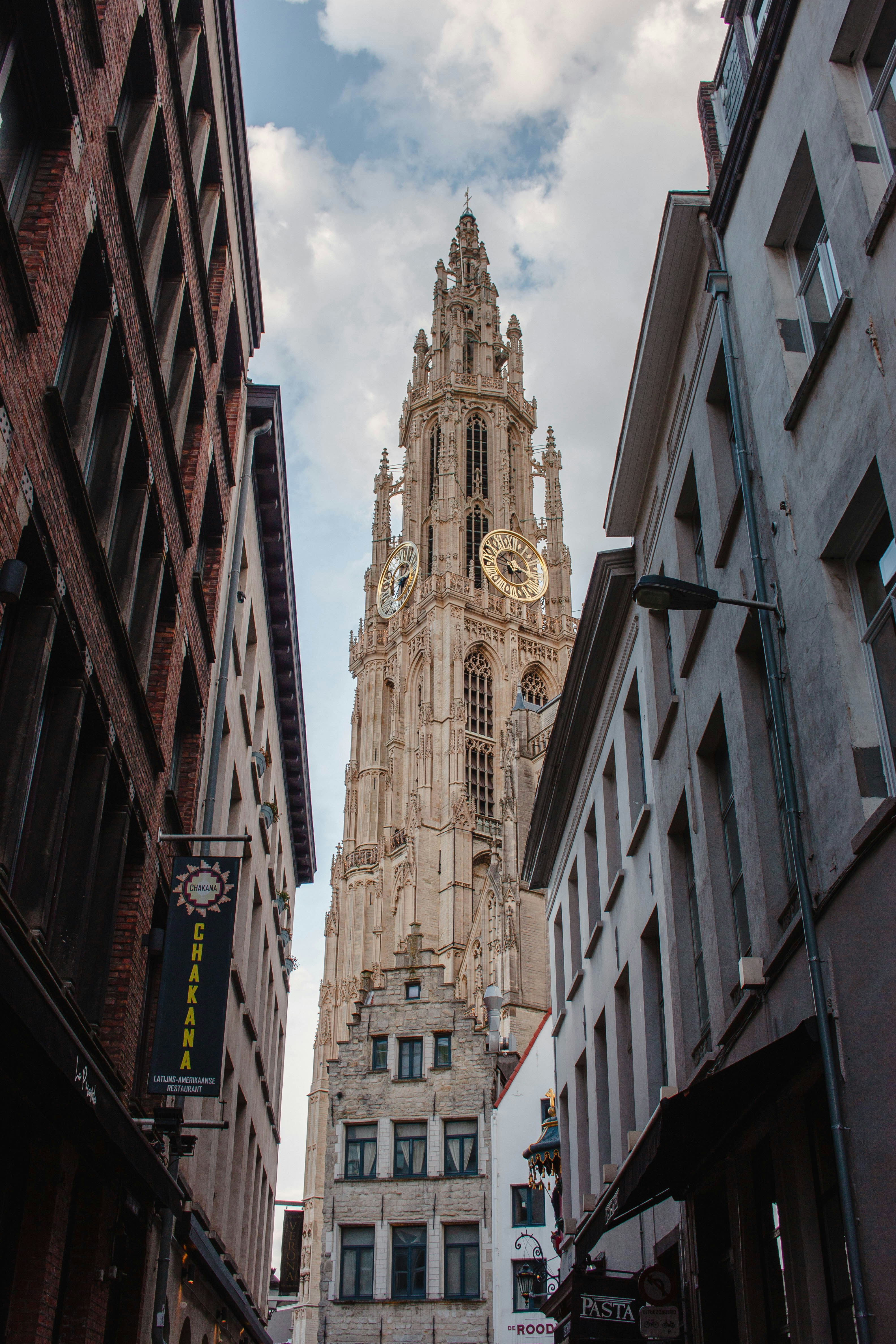 A very tall clock tower towering over a city photo – Free Building ...